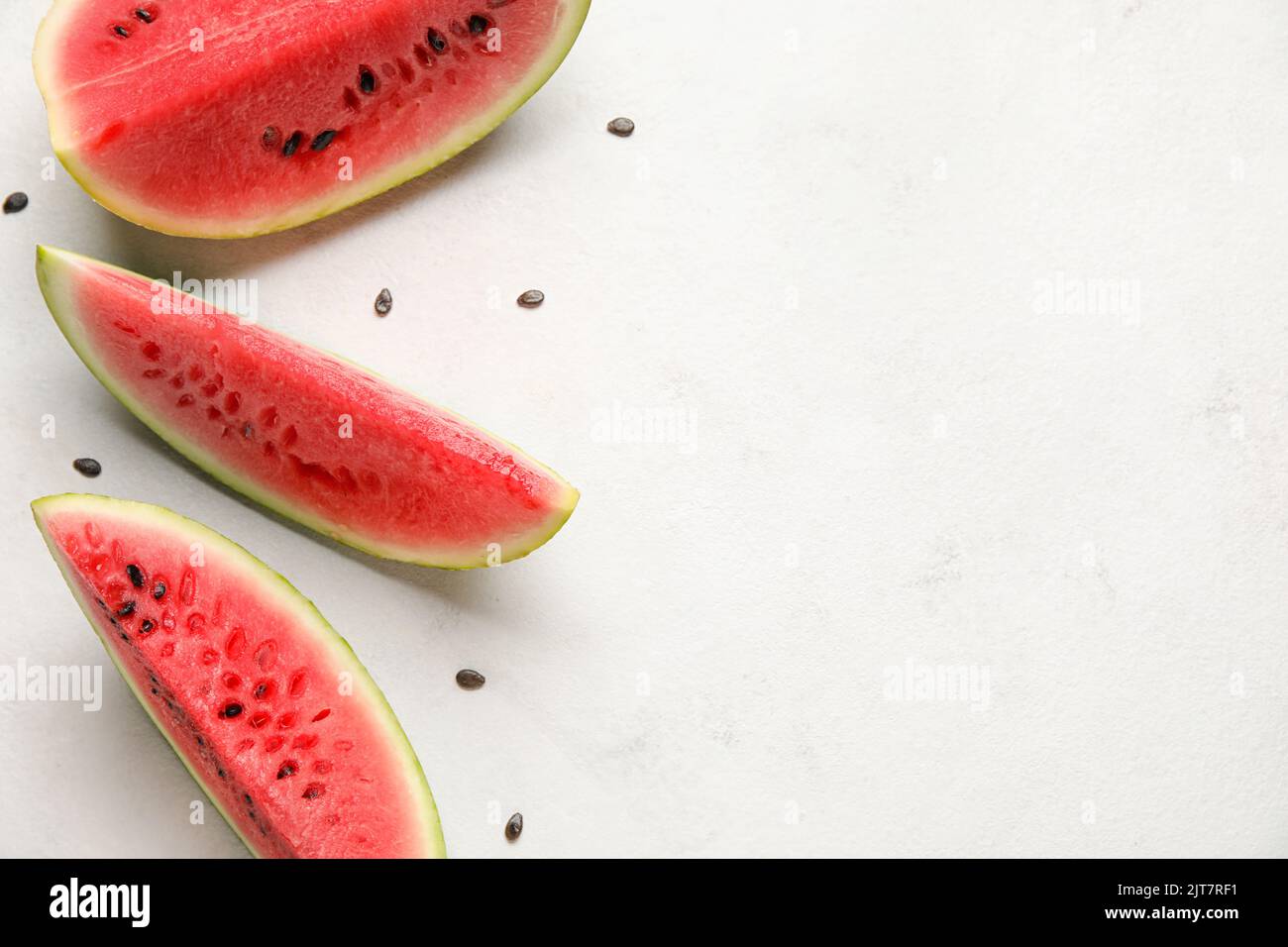 Slices of watermelon with seeds on white background Stock Photo - Alamy