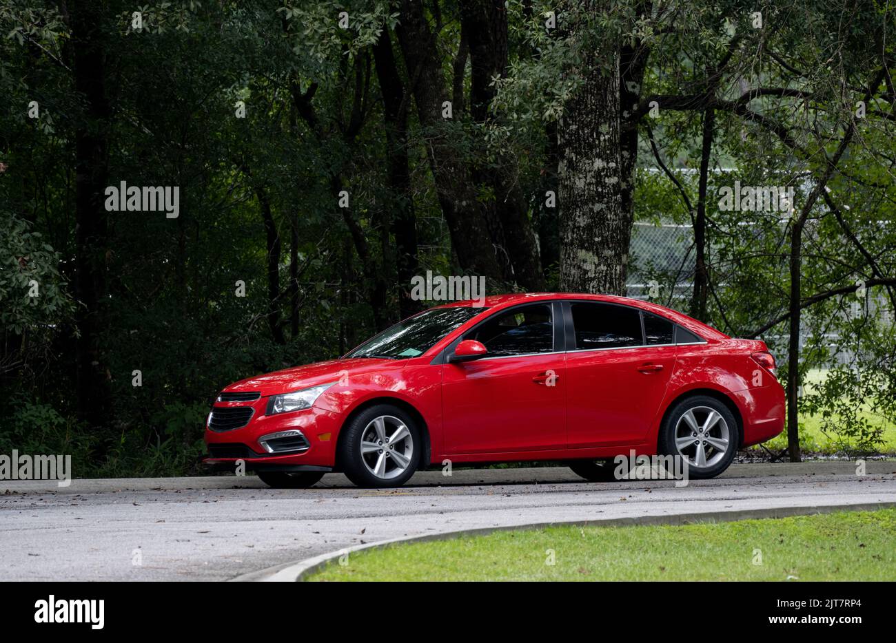 A red Chevrolet Cruze a compact car that is produced by General Motors ...