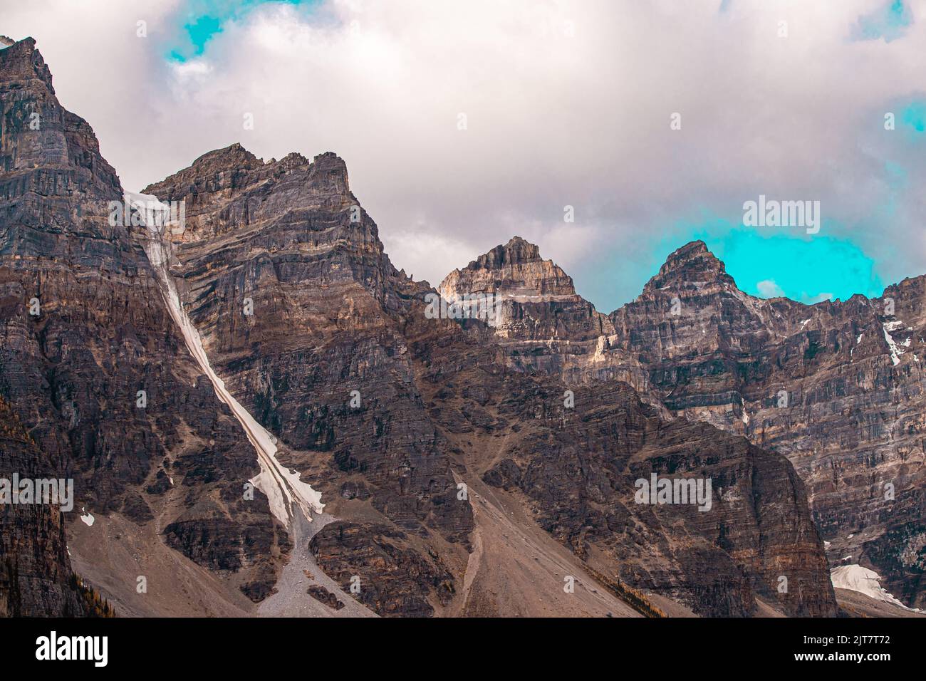 The beautiful bald rocky mountains under the cloudy sky in Banff ...