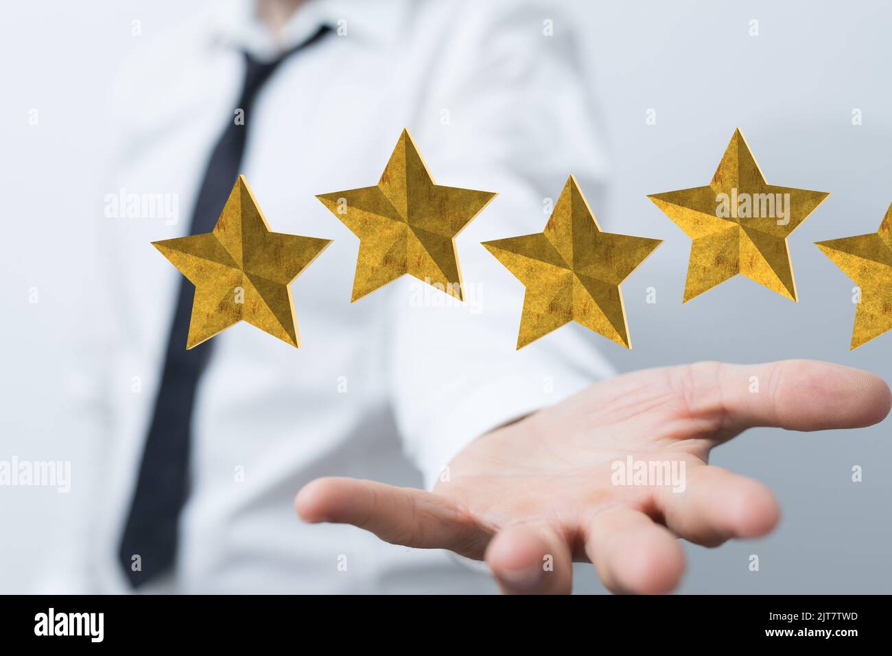 The five golden stars flying over the palm of a man - raiting concept ...