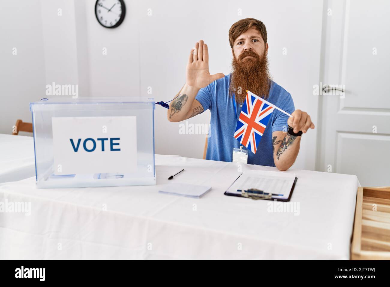 Caucasian man with long beard at political campaign election holding uk ...