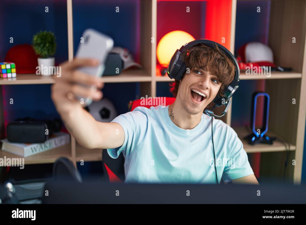 Young blond man streamer smiling confident make selfie by smartphone at ...