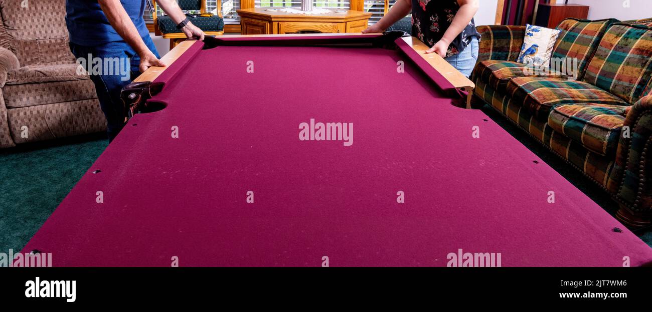 Red felt pool table is in the process of disassembly Stock Photo - Alamy