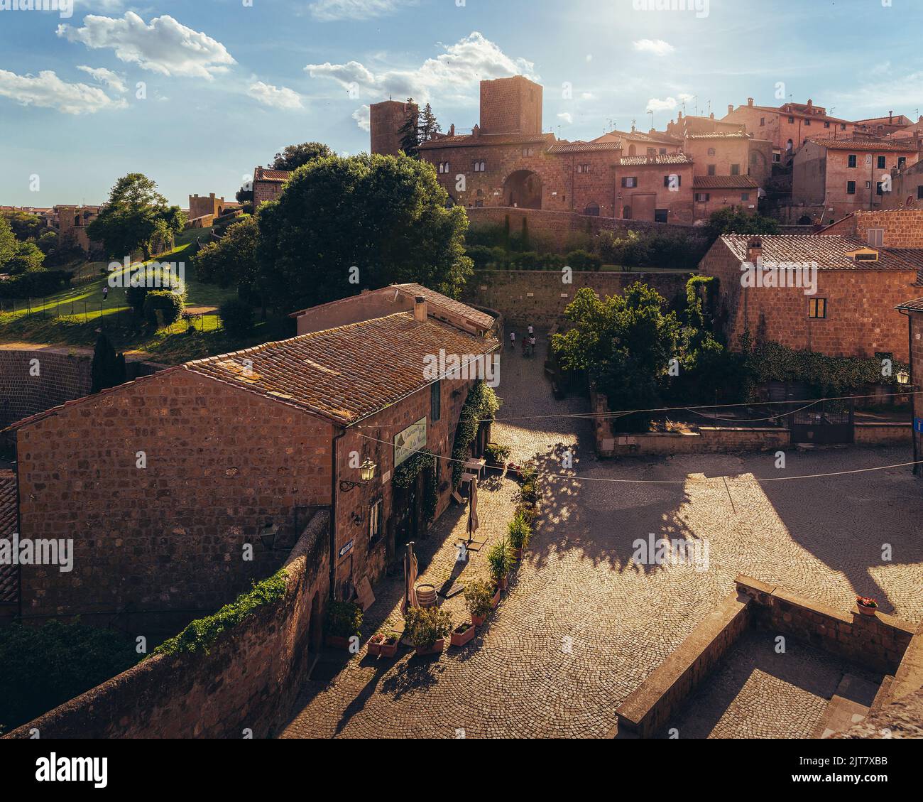 The old houses and greenery of the Italian village of Tuscania Stock ...