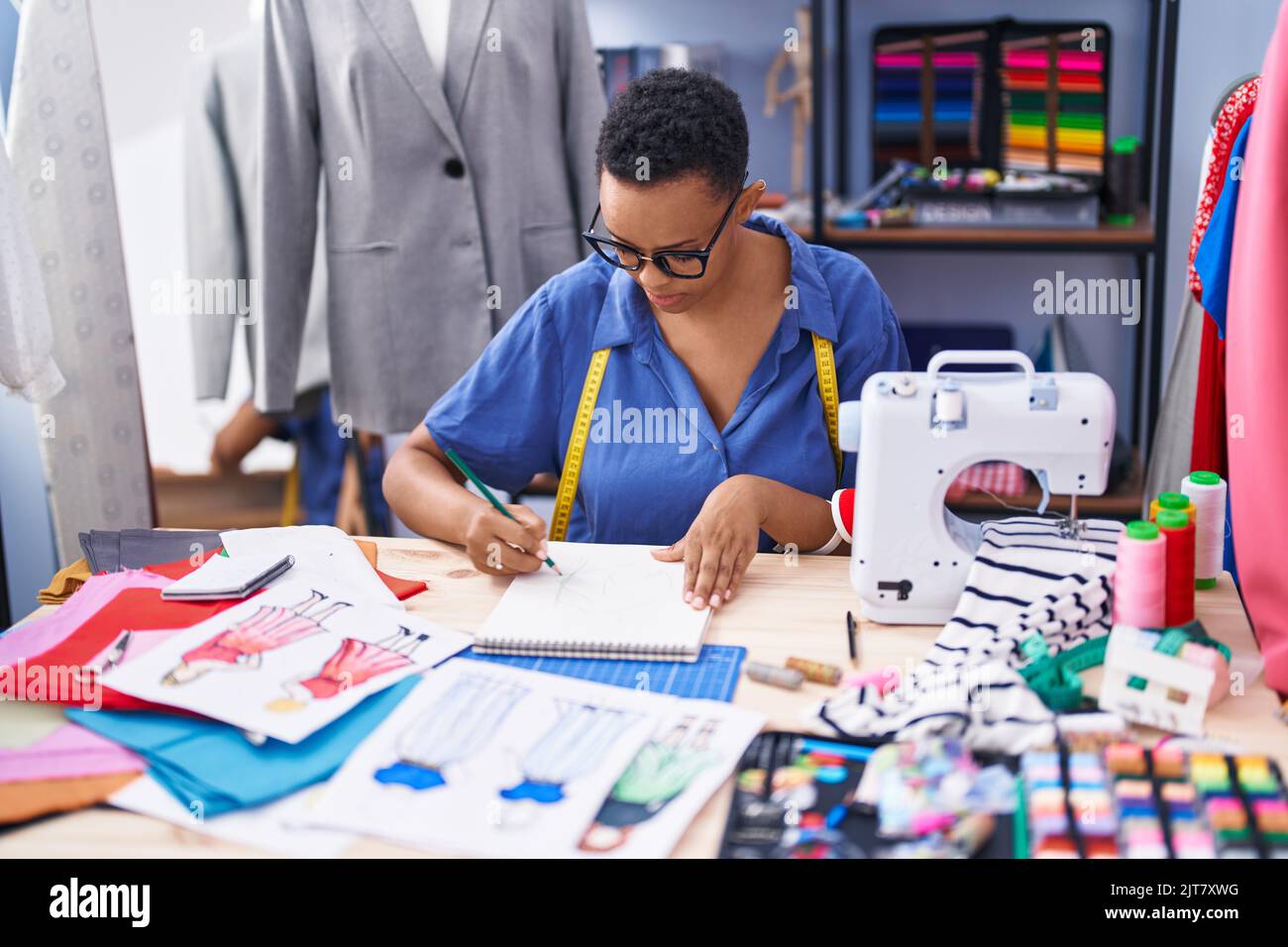 African american tailor drawing clothes hi-res stock photography and ...