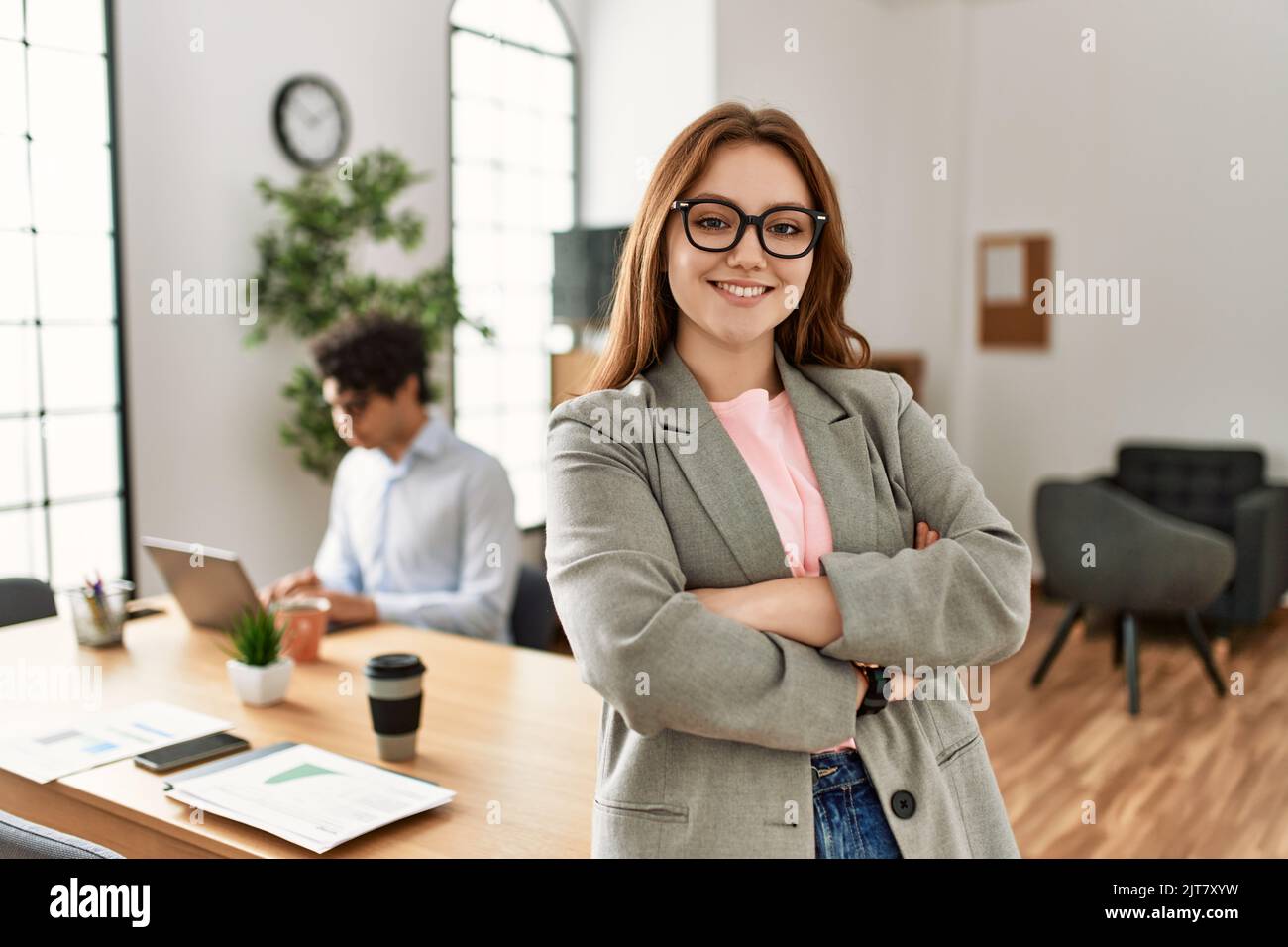 Business manager smiling happy with arms crossed gesture. Employee ...