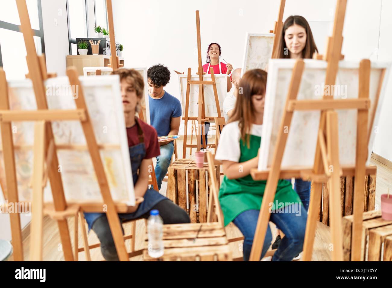 Group of young draw students smiling happy drawing at art studio Stock ...