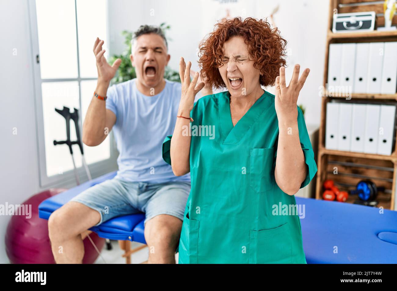 Physiotherapy woman working at pain recovery clinic with patient ...