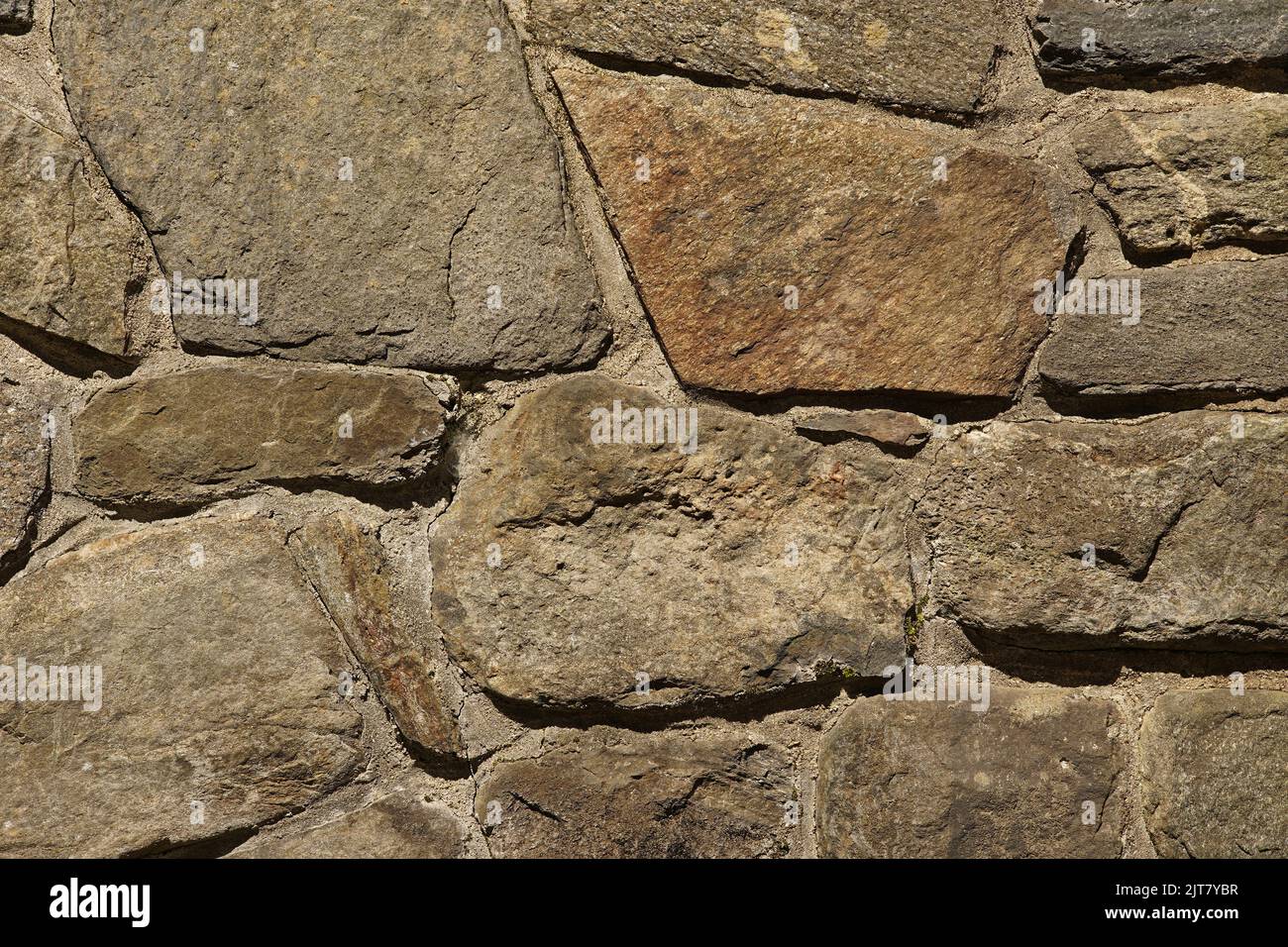 A stone wall which remains of a long ago demolished building Stock ...