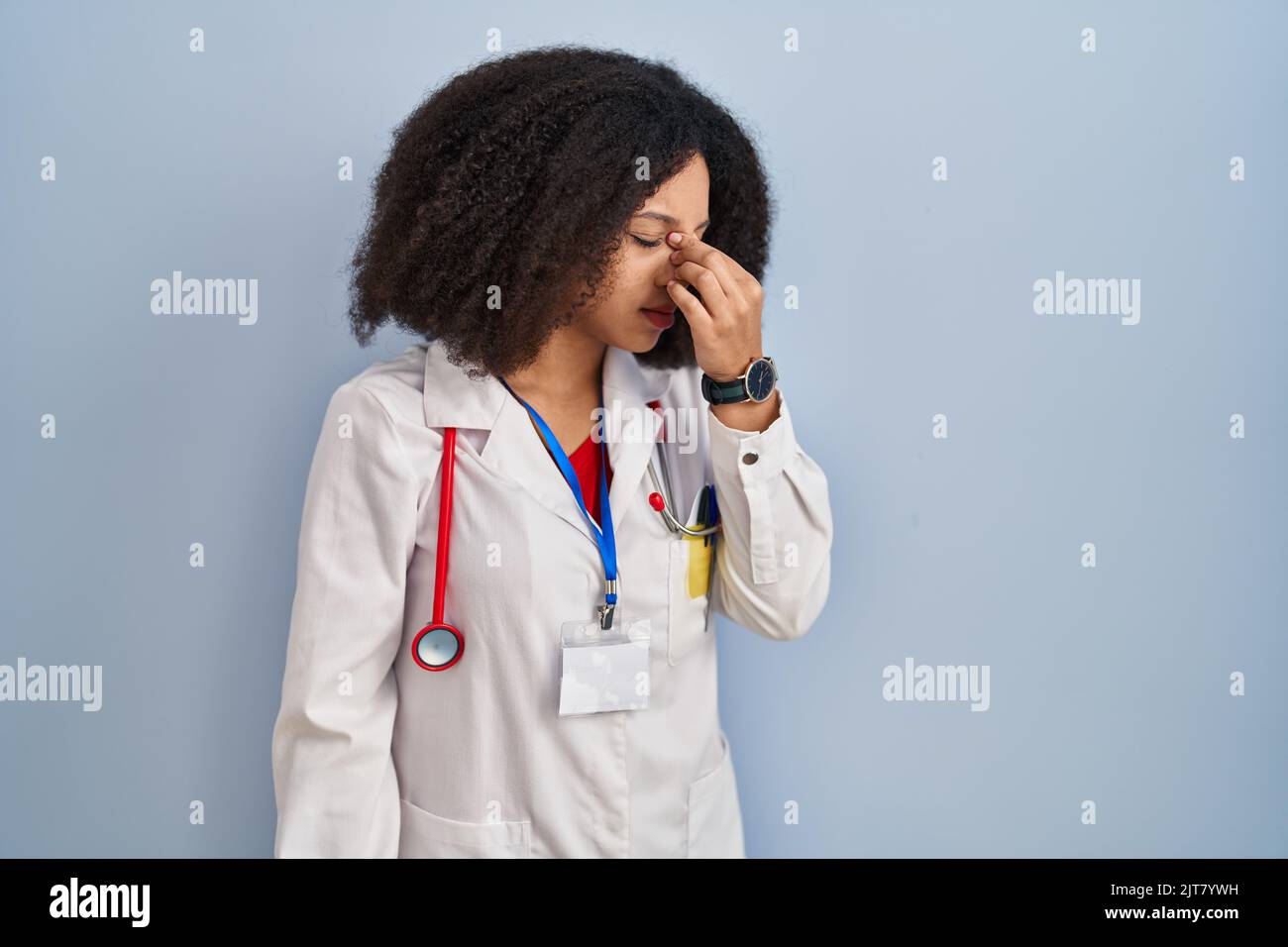 Young african american woman wearing doctor uniform and stethoscope ...