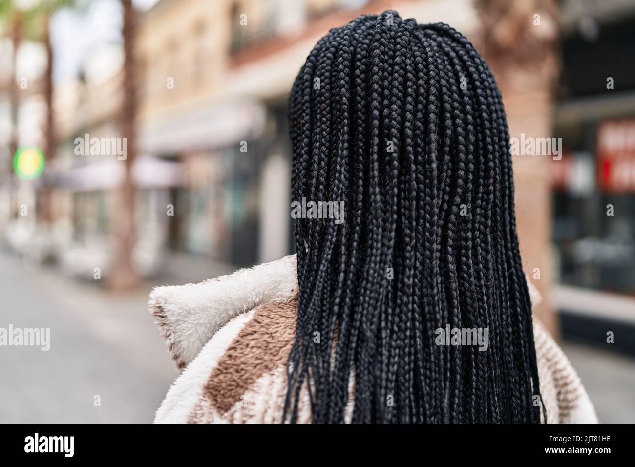 African american woman standing on back view at street Stock Photo - Alamy