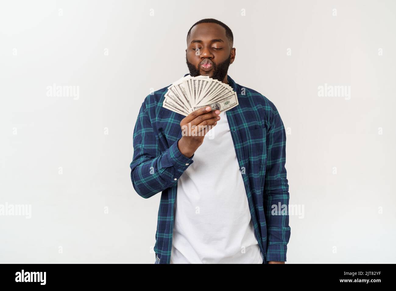 African man holding bank notes happy and surprised cheering expressing ...