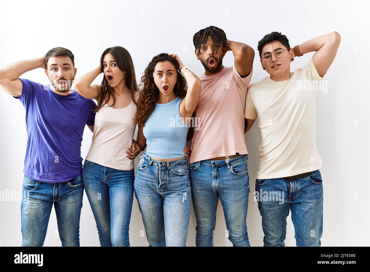 Surprised interracial friends holding hi-res stock photography and ...
