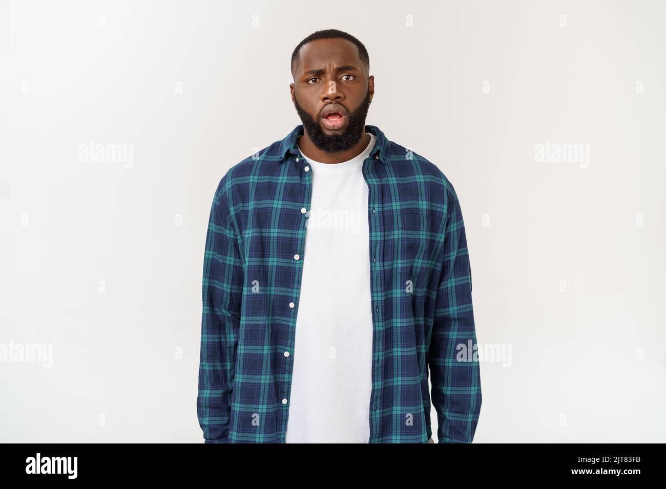 surprised young African American man student staring at camera with shocked look Stock Photo - Alamy