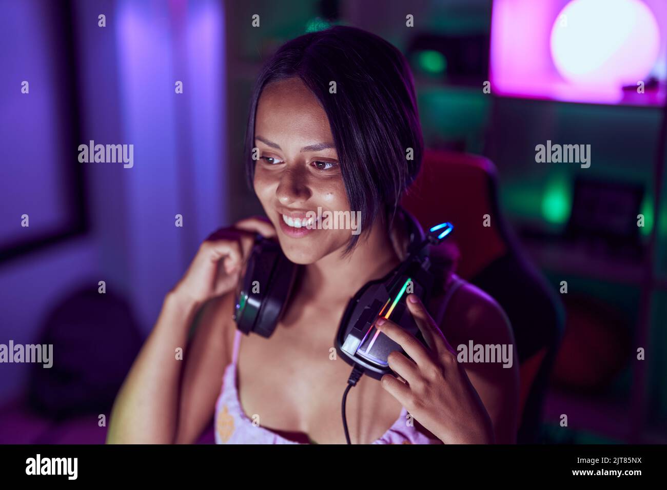 Young hispanic woman streamer smiling confident wearing headphones at ...