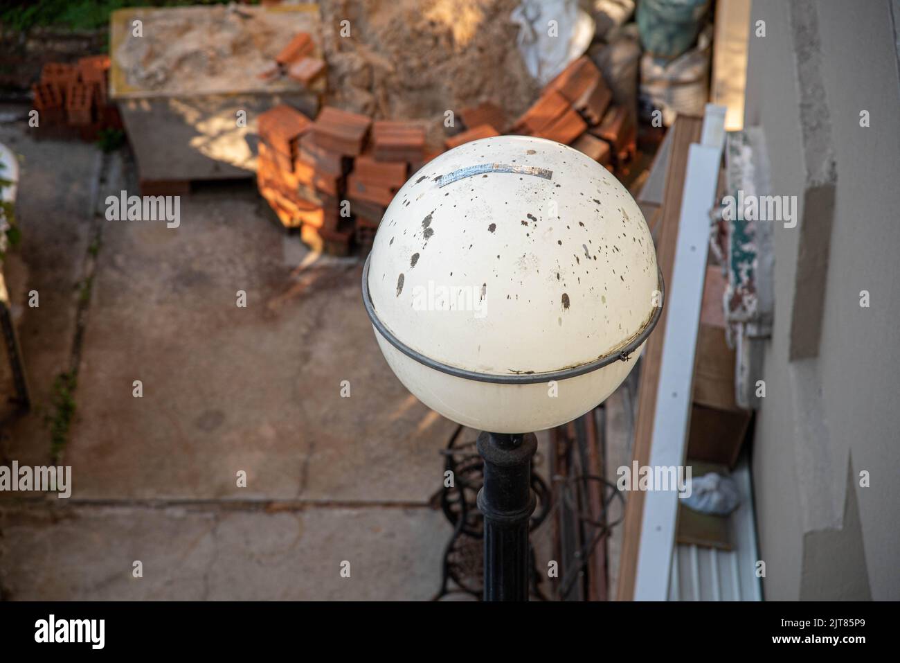Lighting globe smeared with cement drips. Lighting object. Interior ...