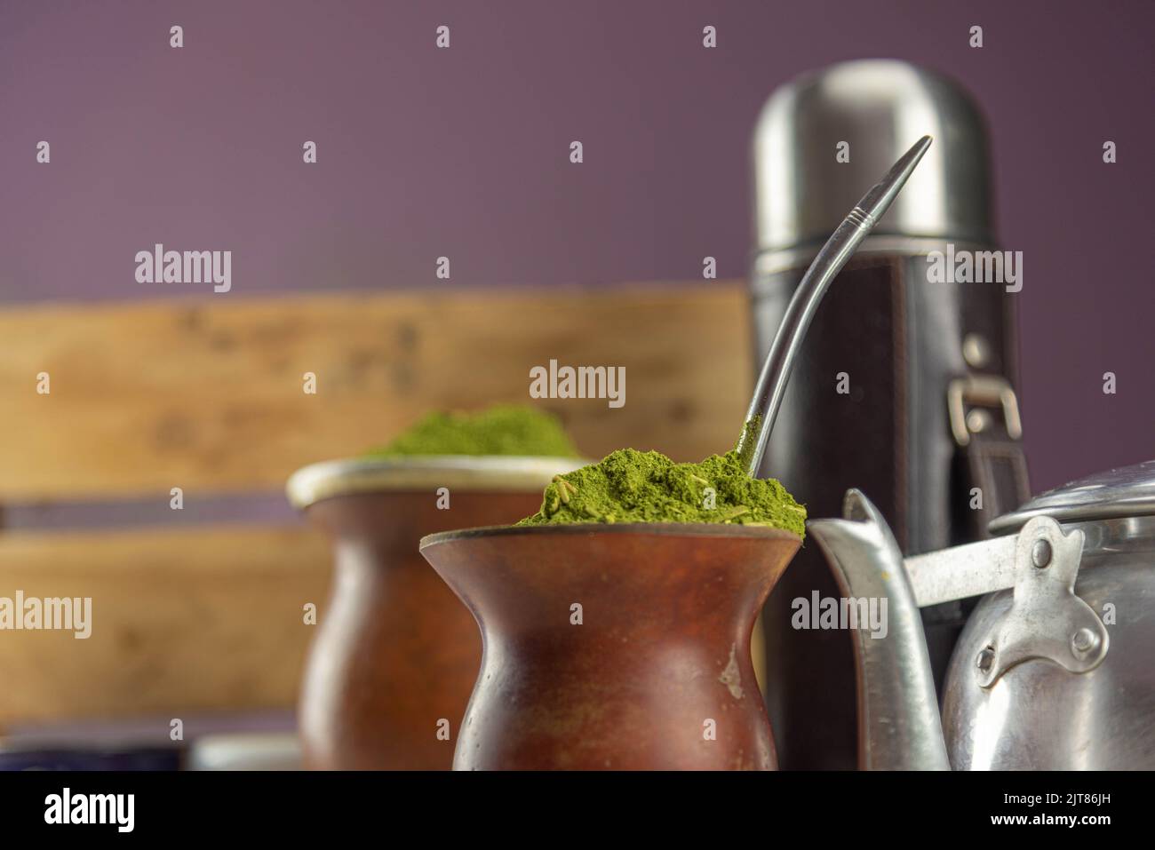 Mate herb (Ilex paraguariensis) and utensils for preparing mate tea ...