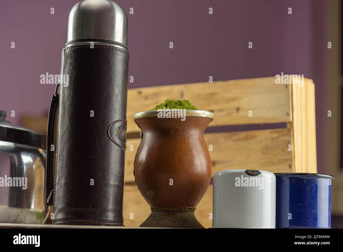 Mate herb (Ilex paraguariensis) and utensils for preparing mate tea ...