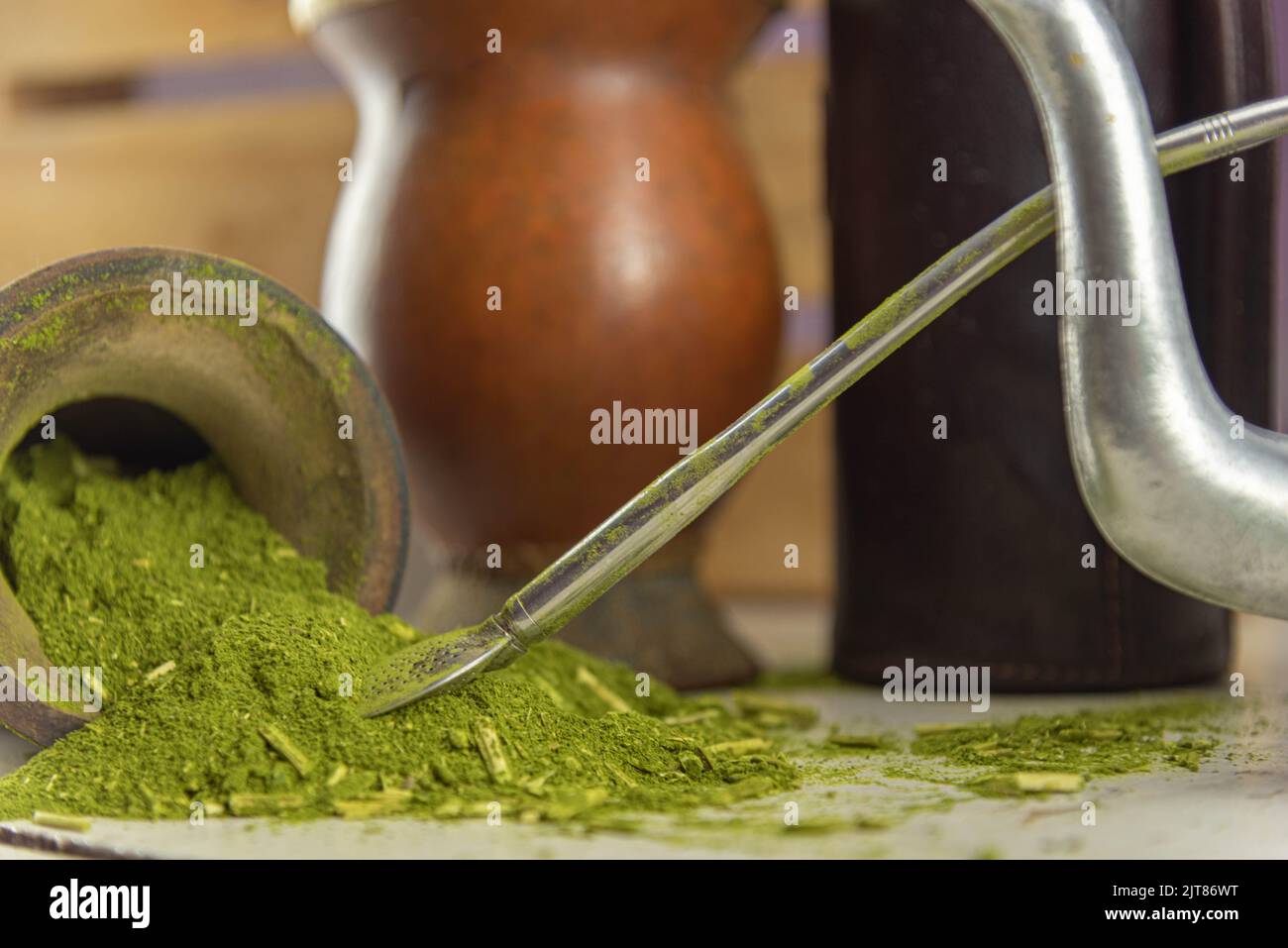 Mate herb (Ilex paraguariensis) and utensils for preparing mate tea ...