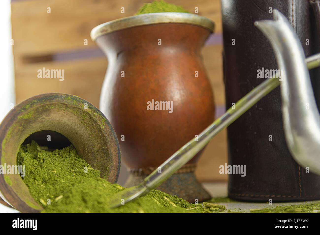 Mate herb (Ilex paraguariensis) and utensils for preparing mate tea ...