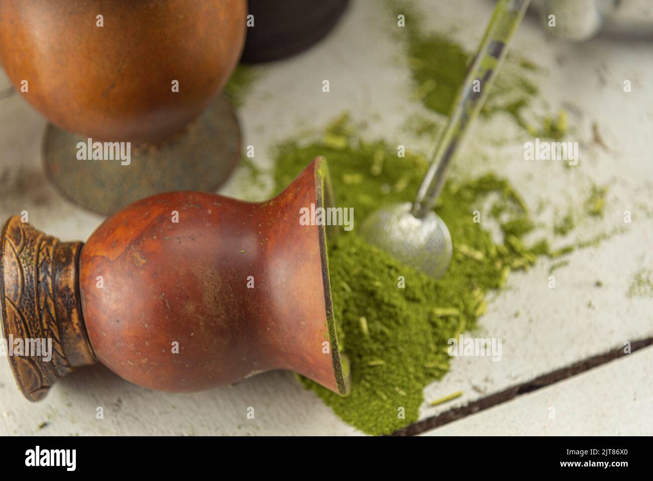 Mate herb (Ilex paraguariensis) and utensils for preparing mate tea ...