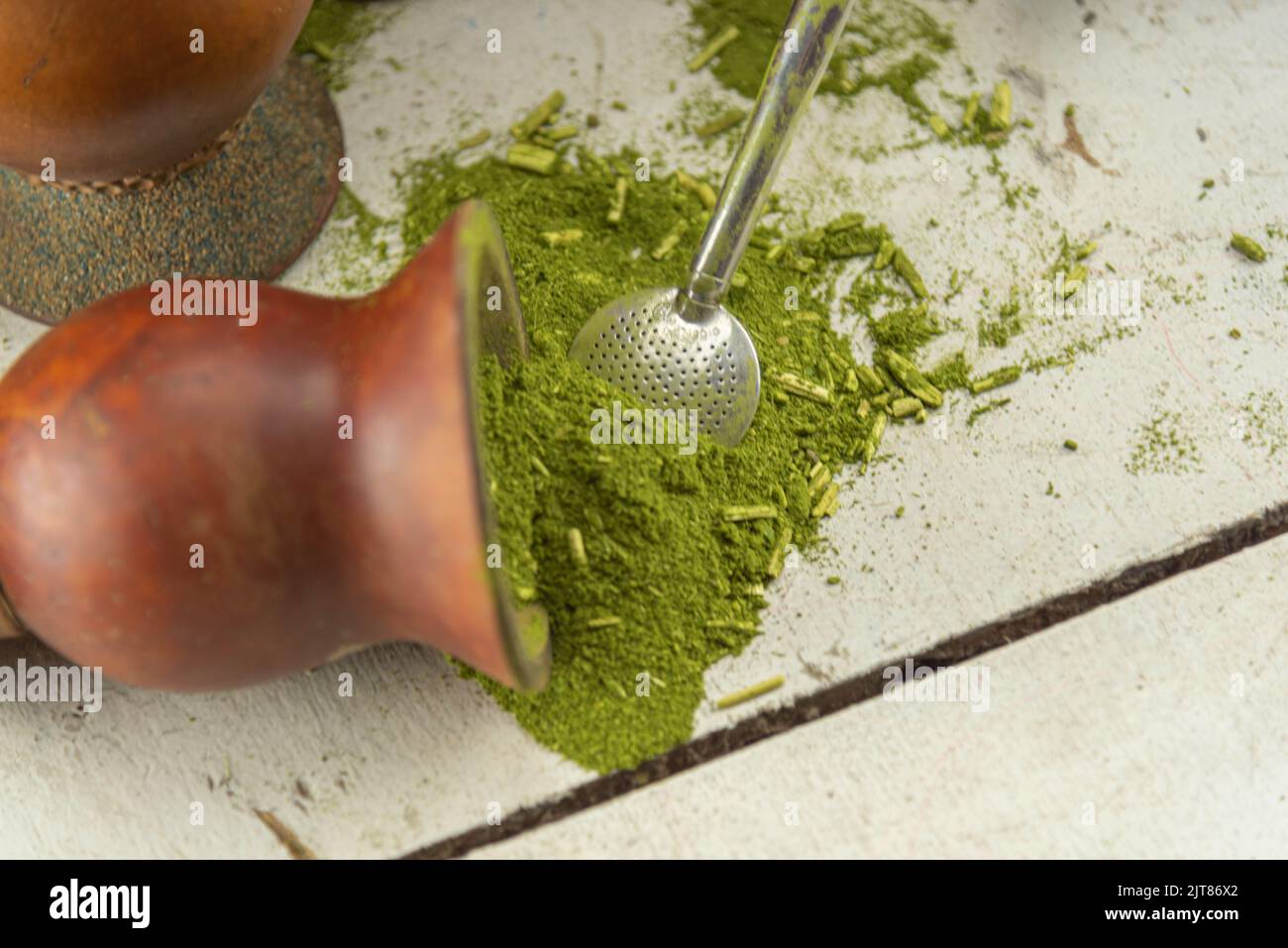 Mate herb (Ilex paraguariensis) and utensils for preparing mate tea ...