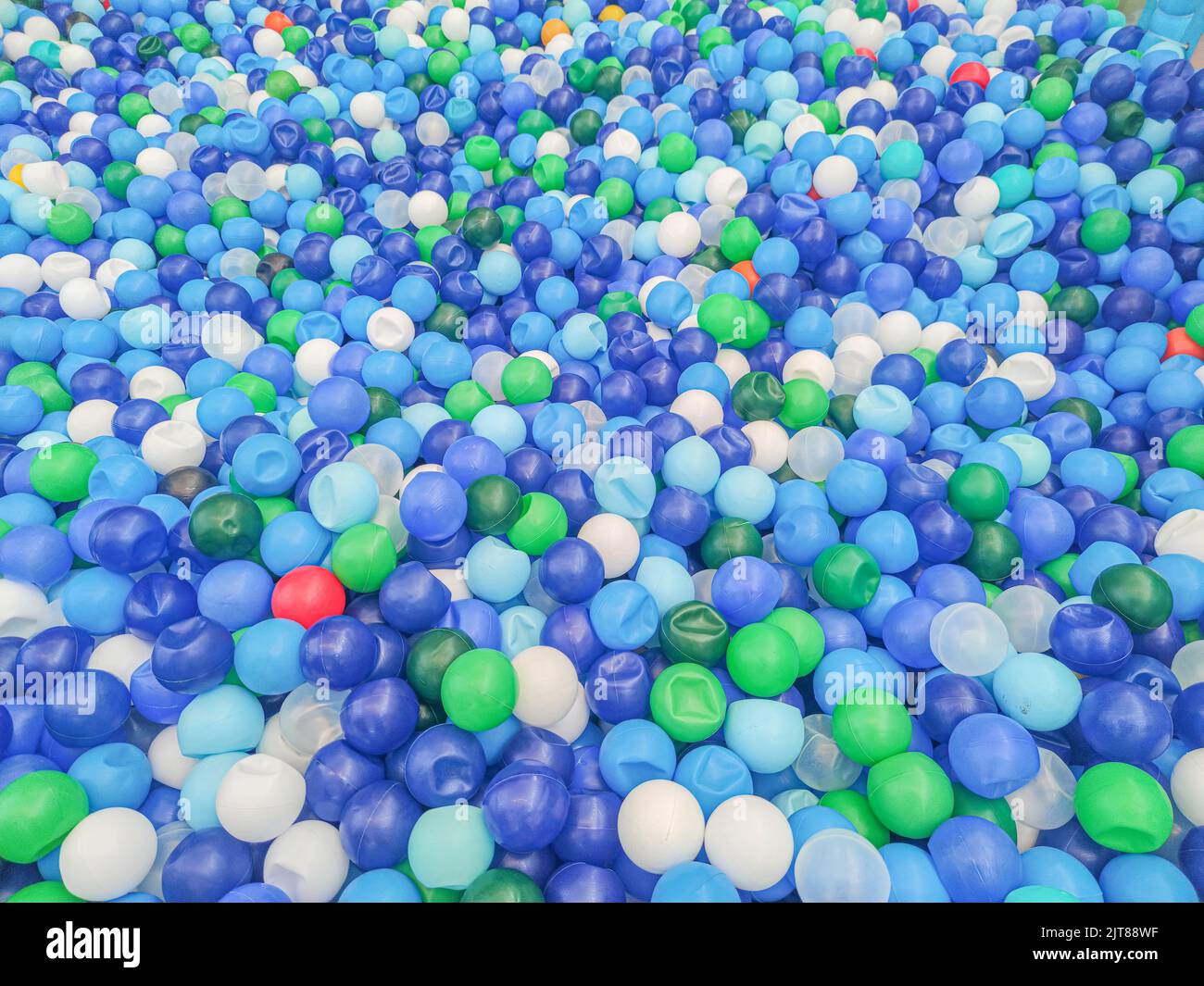 Plastic balls in a children's pool. ball pool. recreation and leisure ...