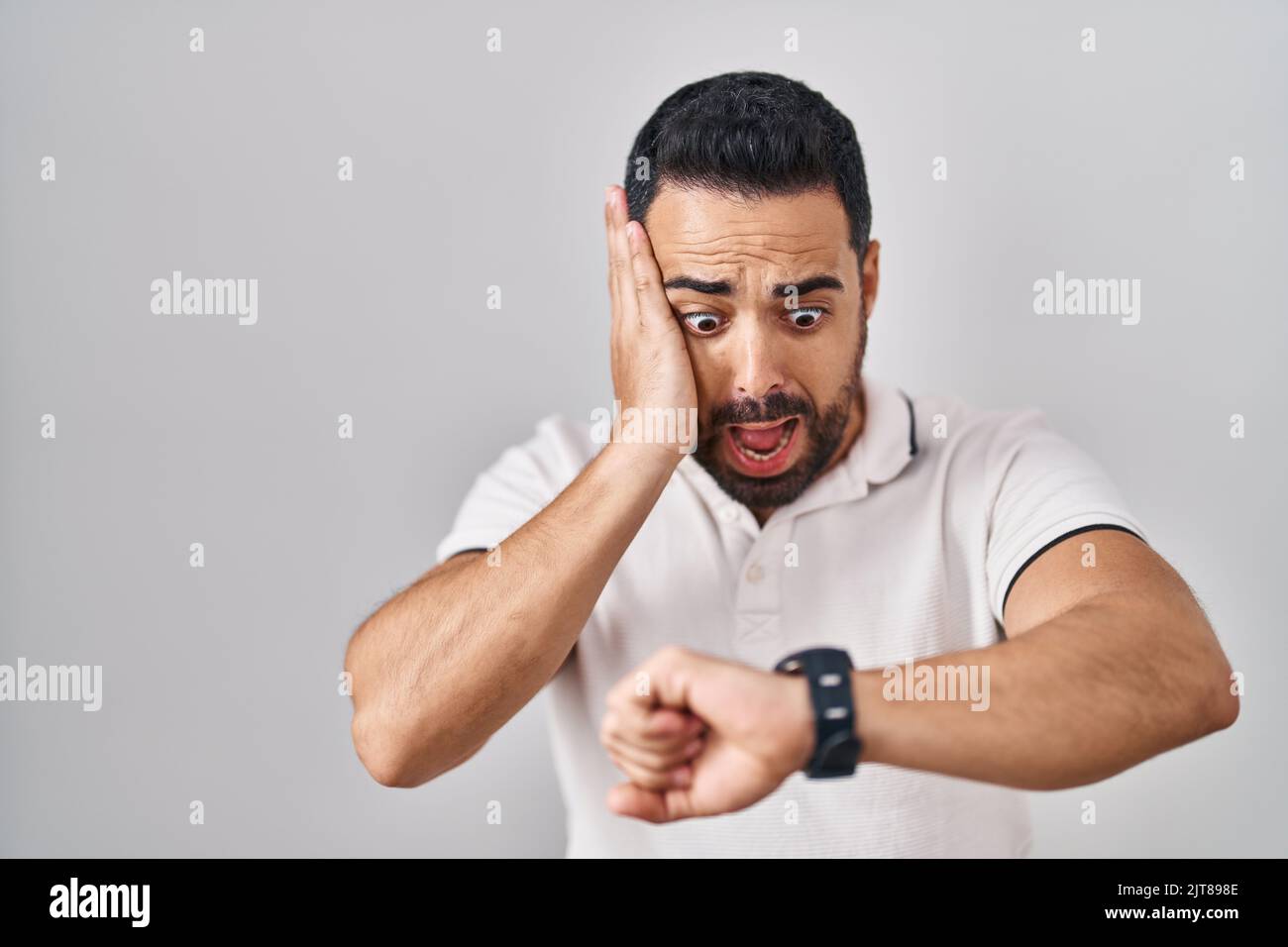 Young hispanic man with beard wearing casual clothes over white ...