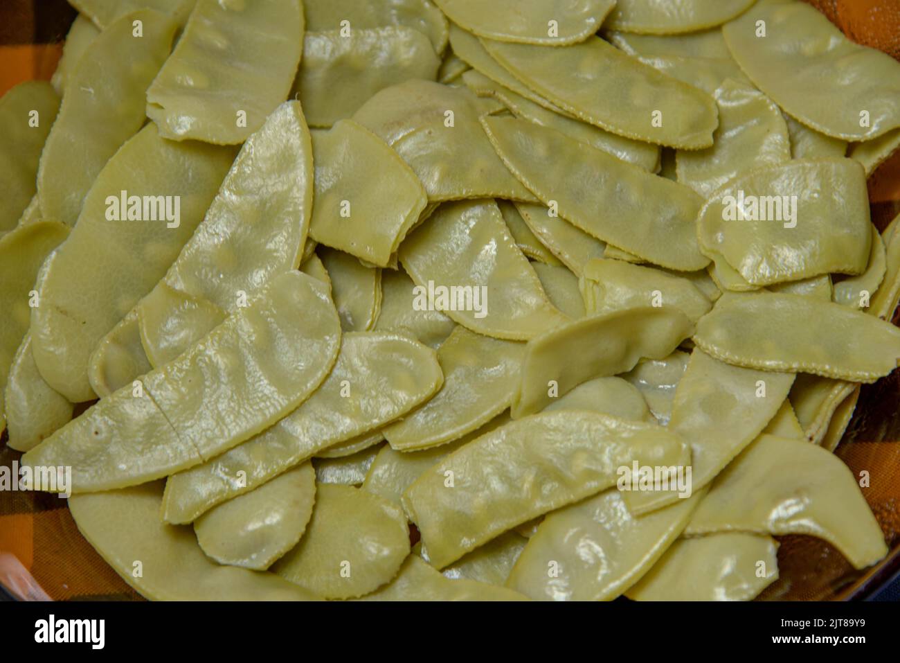 Pod beans served on a platter for consumption. The pod or snap bean is ...