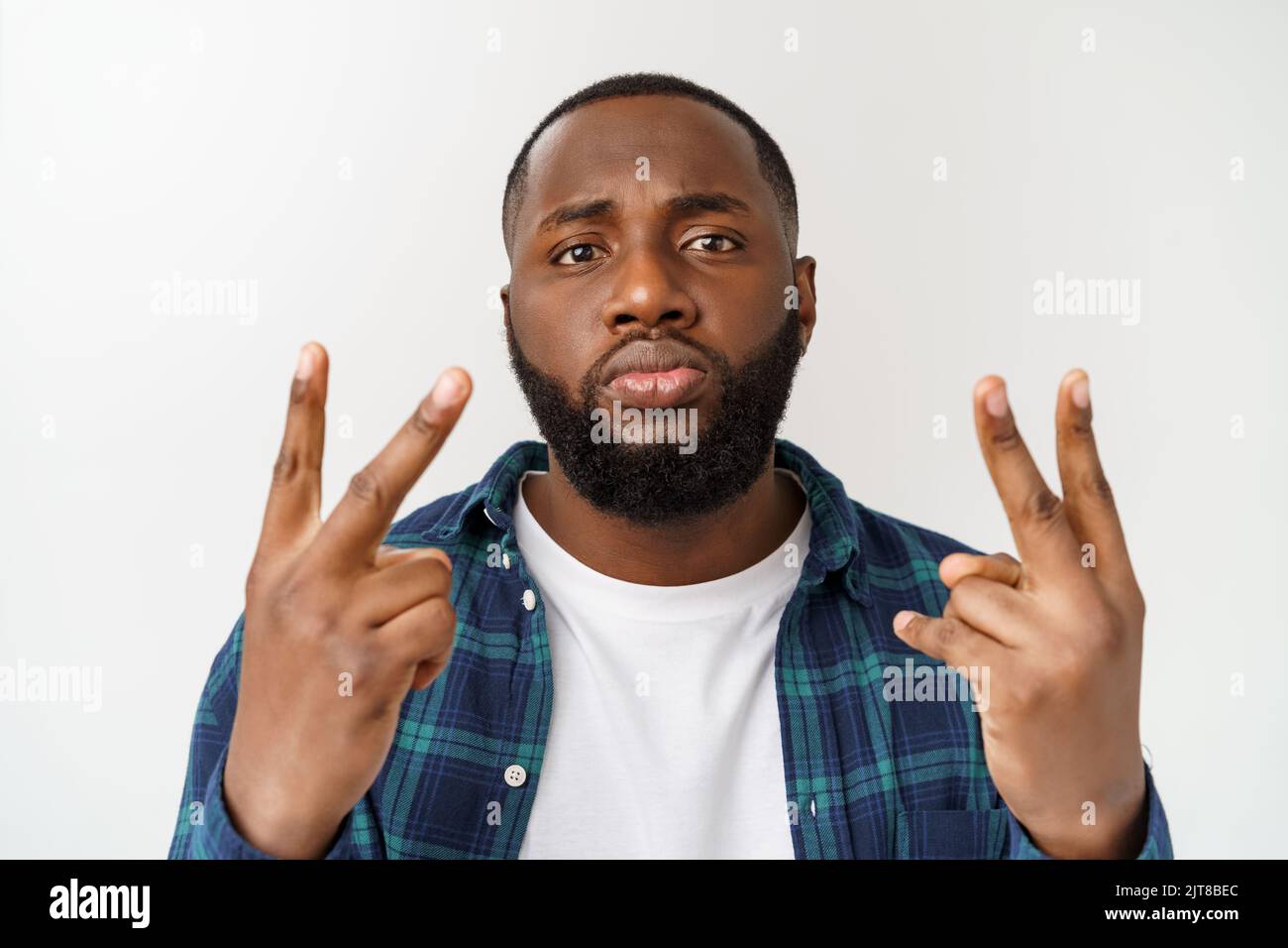 Closeup portrait happy, excited, successful young man giving peace ...