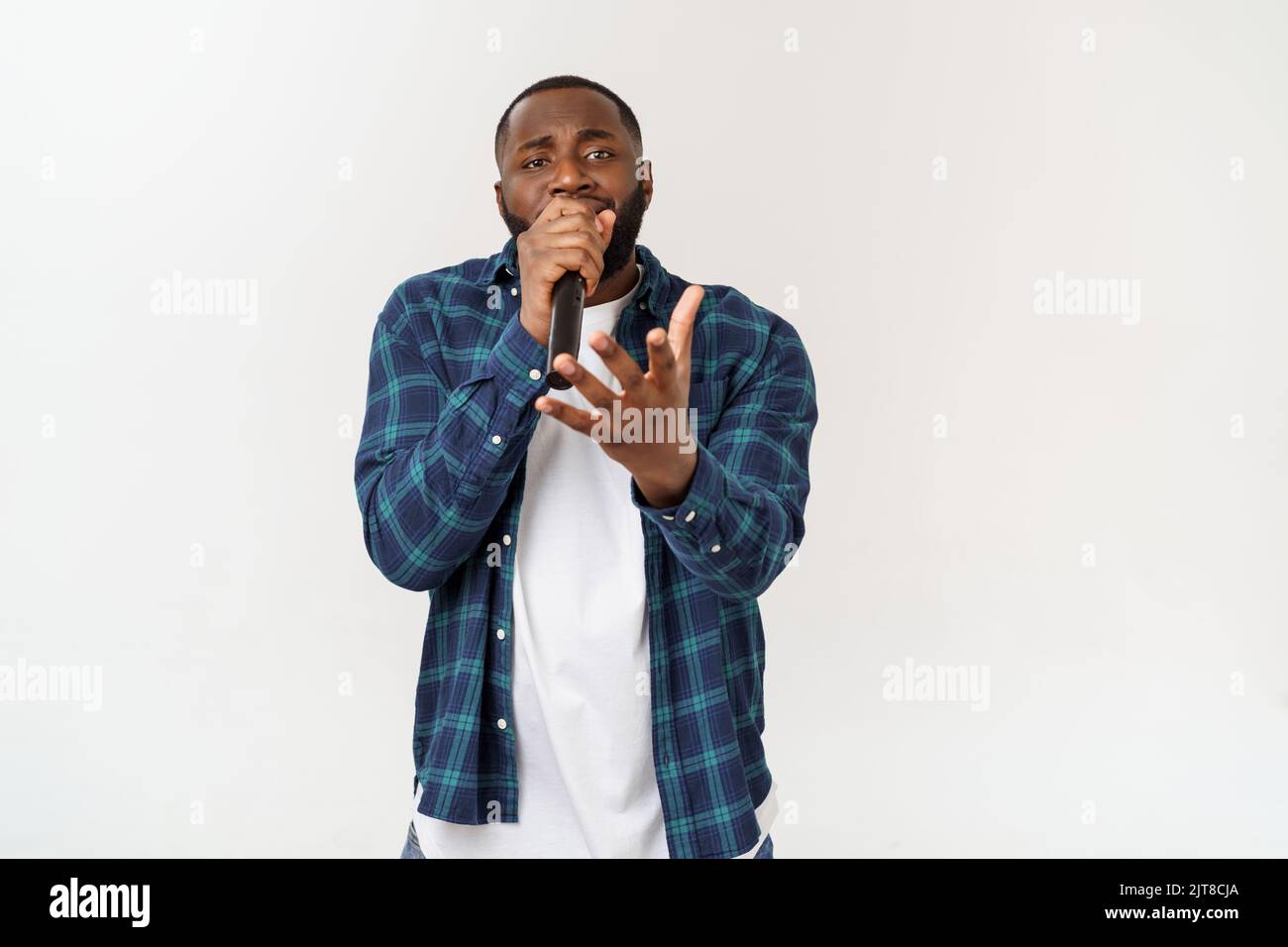 Portrait of cheerful positive chic handsome african man holding ...