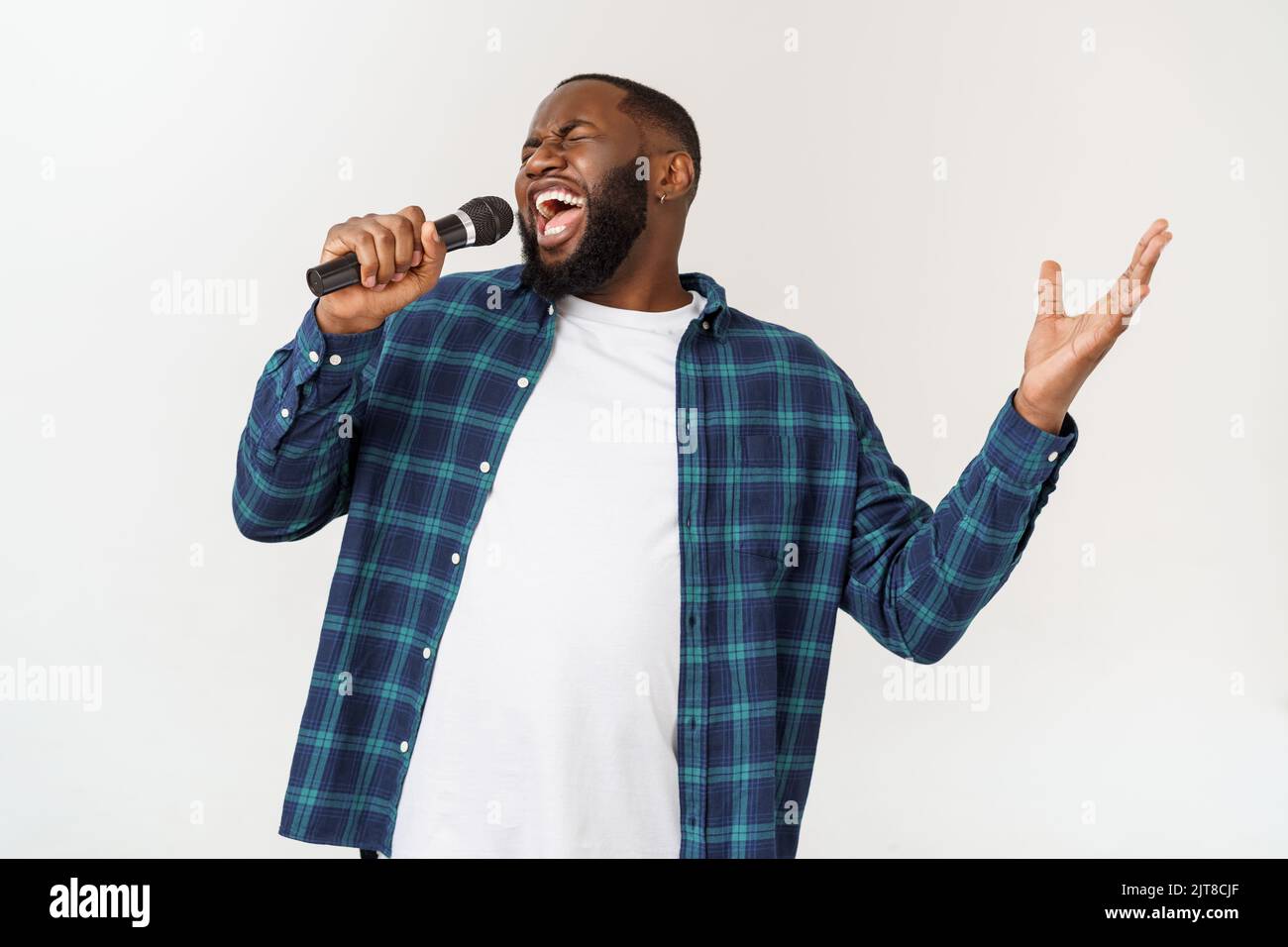 Portrait of cheerful positive chic handsome african man holding ...