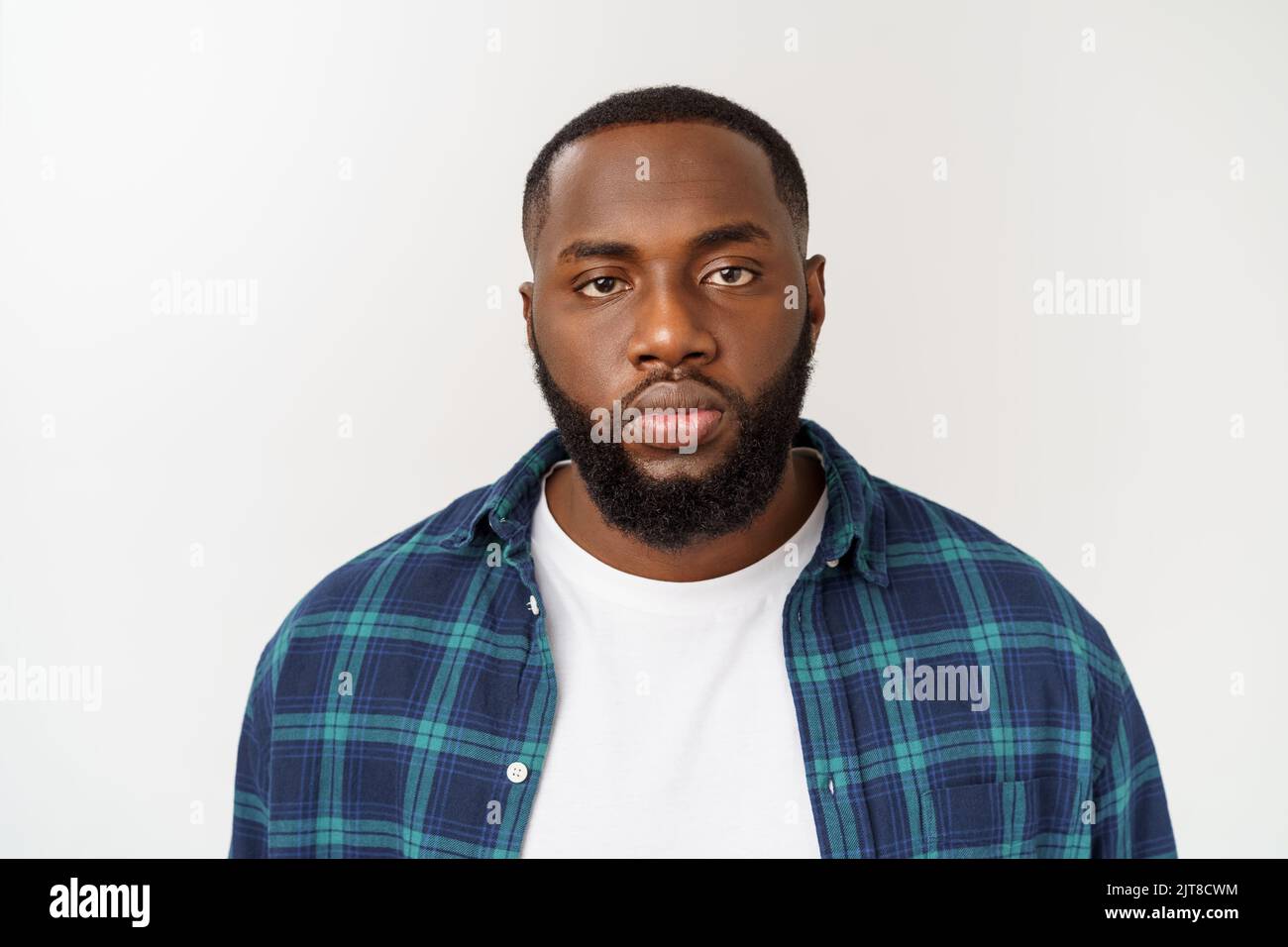 Head shot of an angry African-american man looking sharply towards the ...