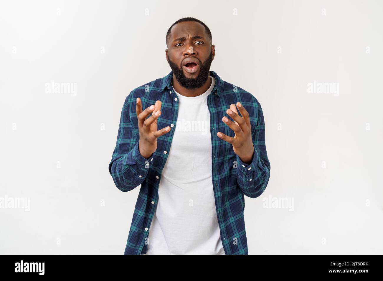 surprised young African American man student staring at camera with shocked look Stock Photo - Alamy