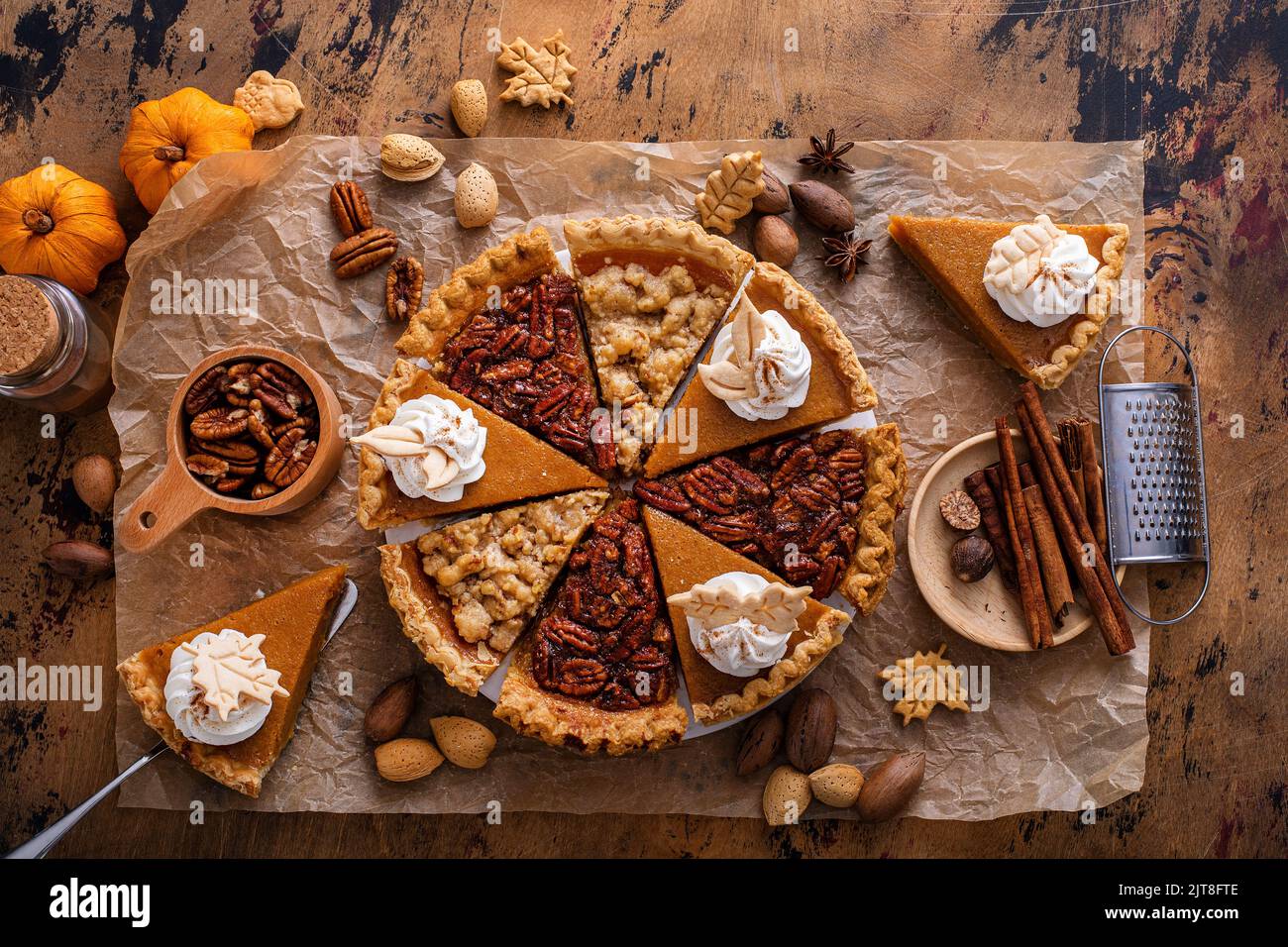 Traditional fall Thanksgiving pies variety of slices arranged into ...