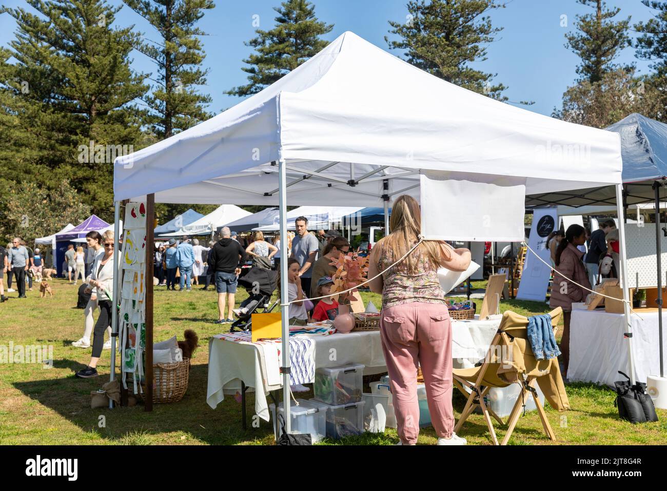Palm Beach in Sydney, sunny winters day and market stalls on market day ...