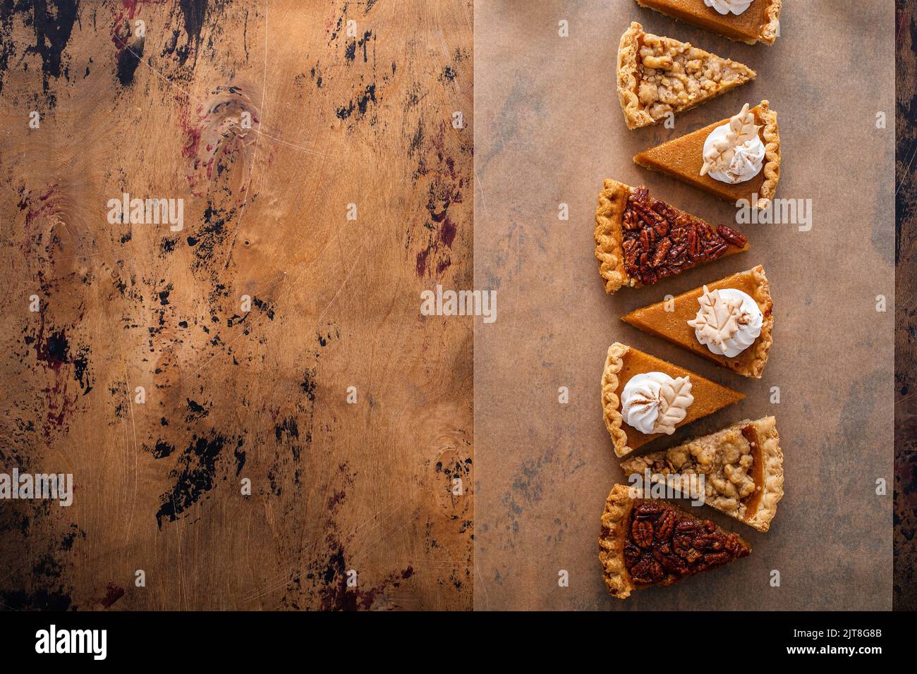 Traditional fall Thanksgiving pies variety of slices arranged on ...