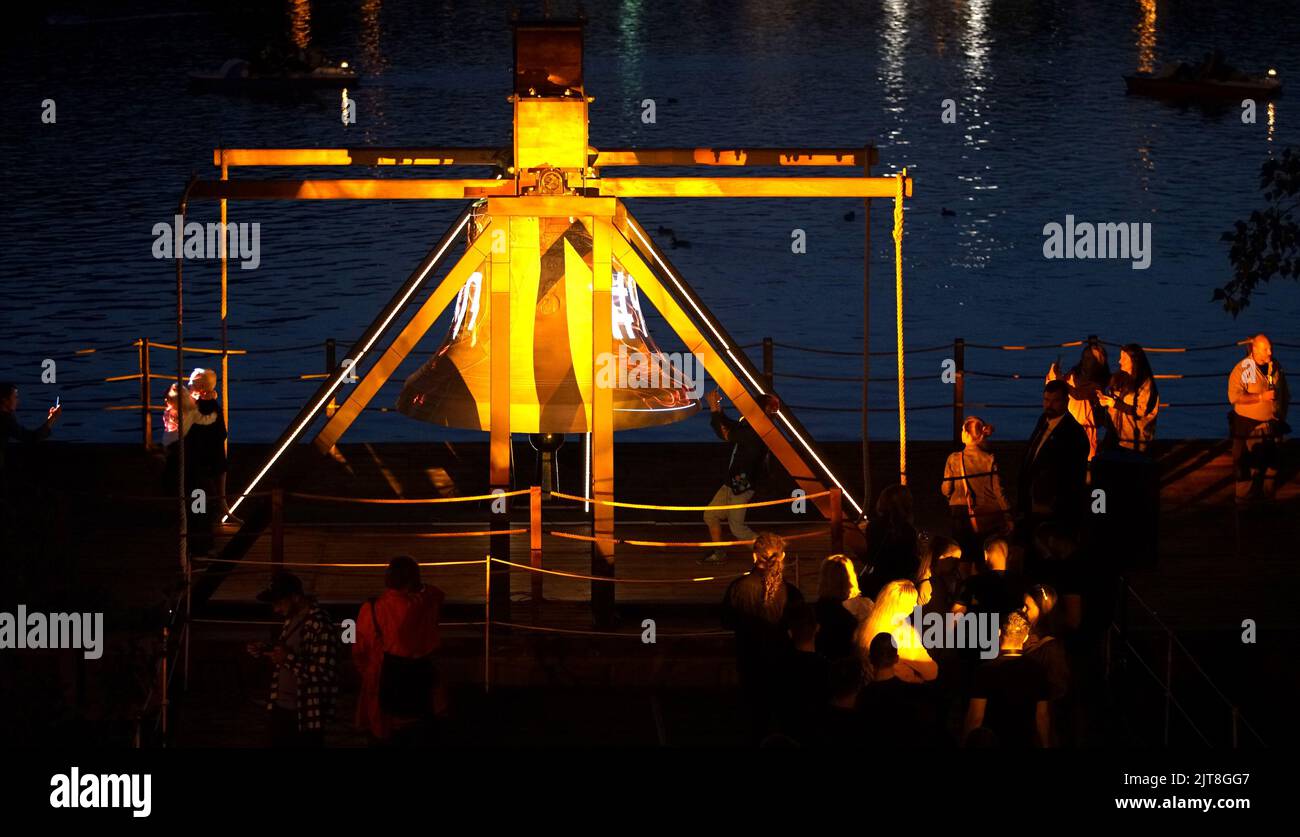 Prague, Czech Republic. 28th Aug, 2022. People look at a memorial bell ...