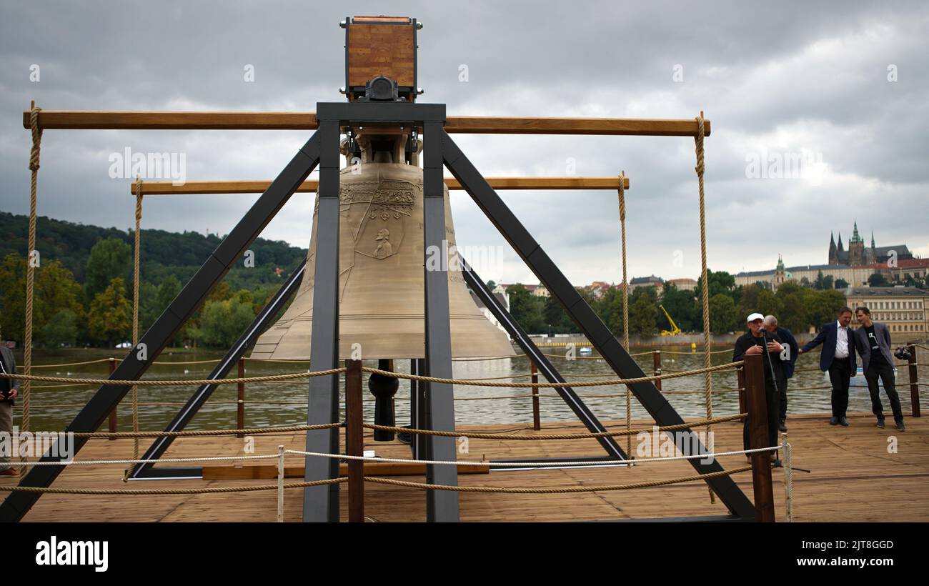 Prague, Czech Republic. 28th Aug, 2022. People look at a memorial bell ...