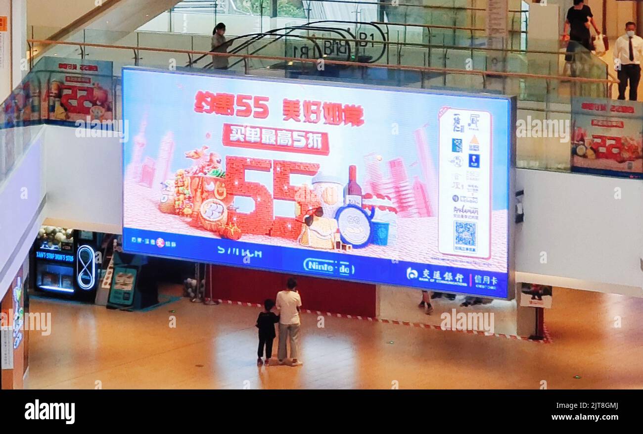SHANGHAI, CHINA - AUGUST 28, 2022 - Citizens shop at a mall in Shanghai ...