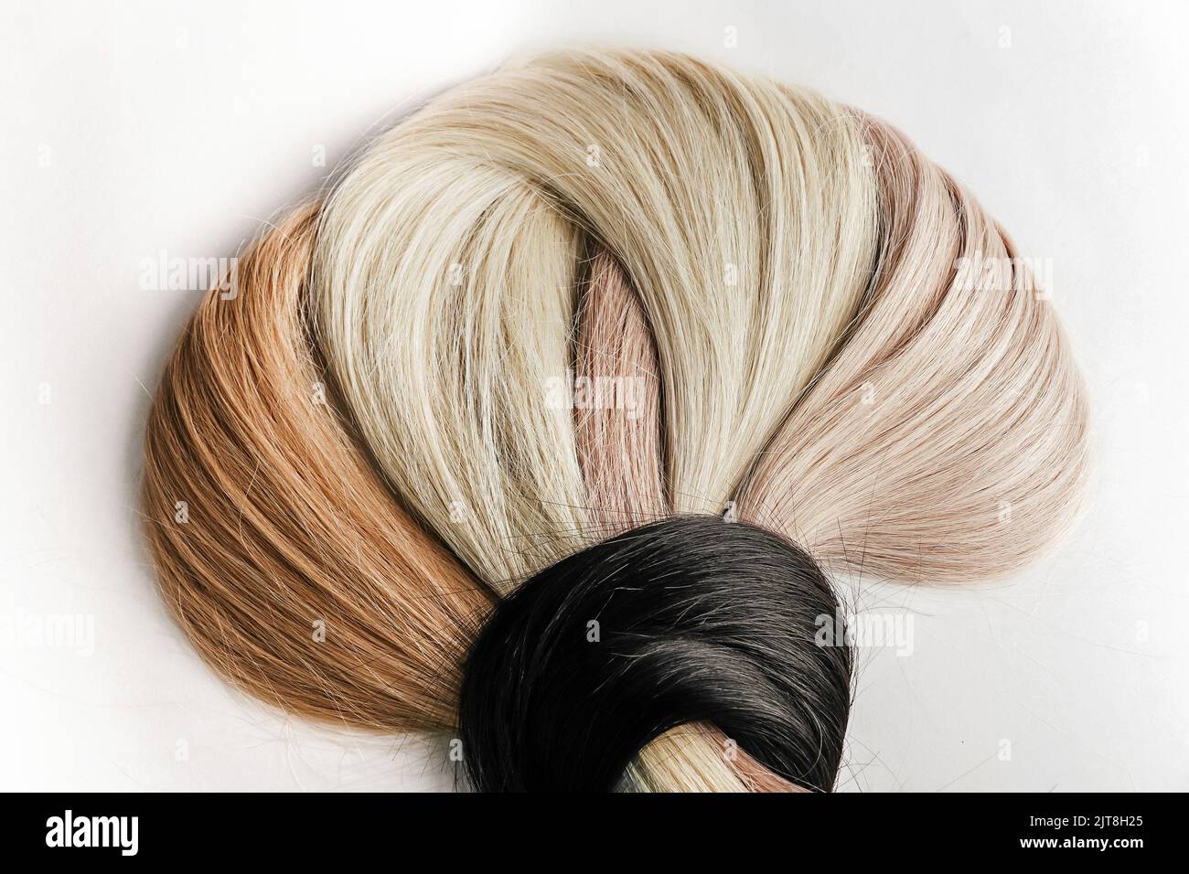 Curved hair samples for extension,different colors.White background ...