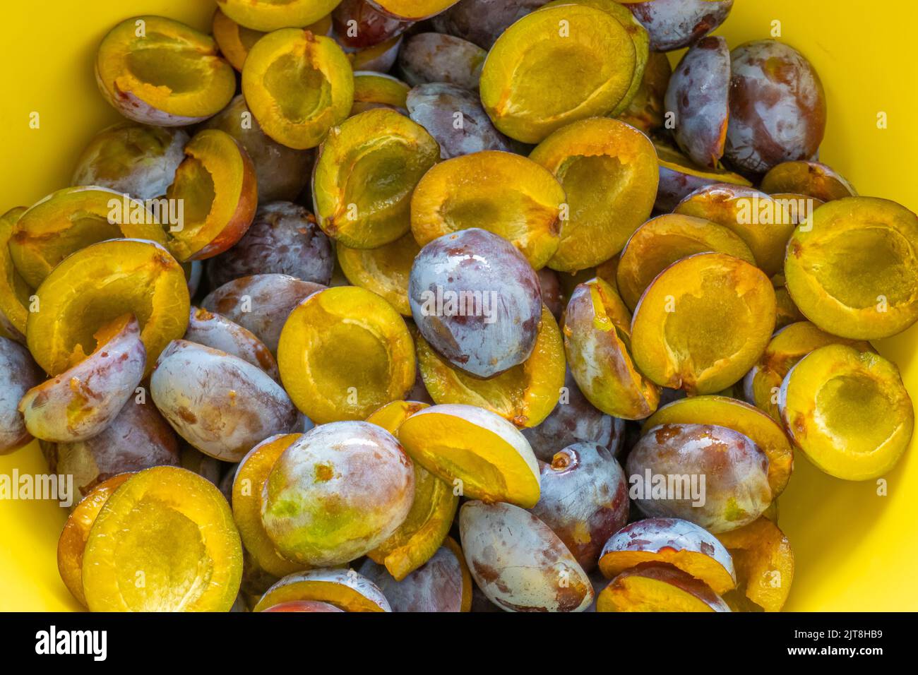 plum abundance . Plum halves background. Juicy pulp of plums texture ...