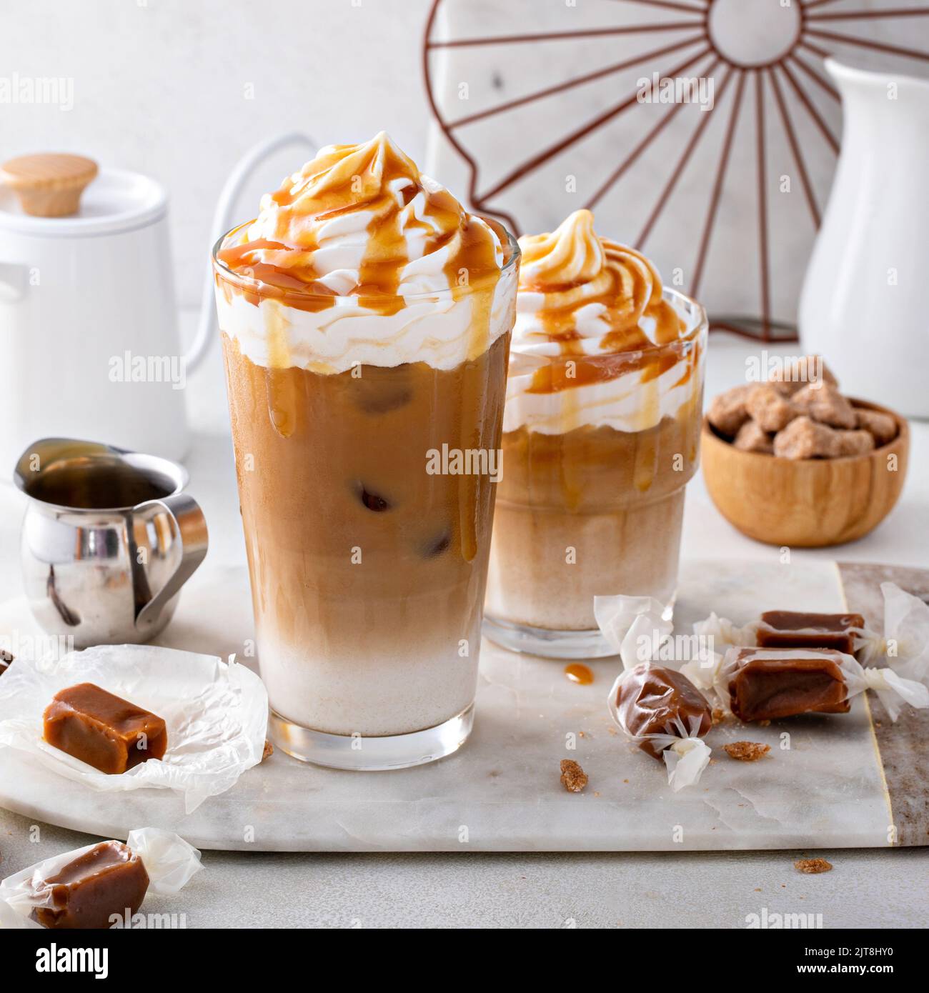 Iced caramel latte topped with whipped cream and caramel sauce Stock ...