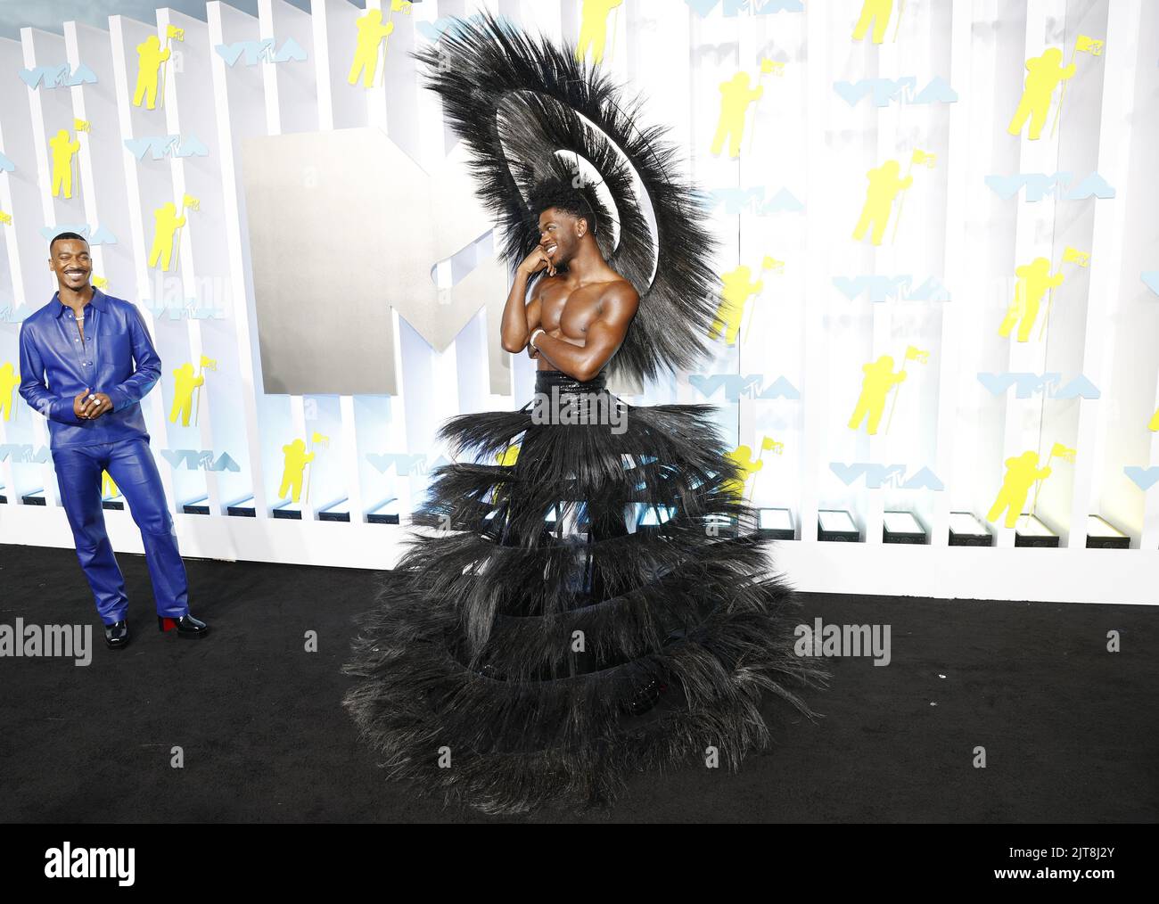 Newark, United States. 28th Aug, 2022. Lil Nas X, center and arrives on ...