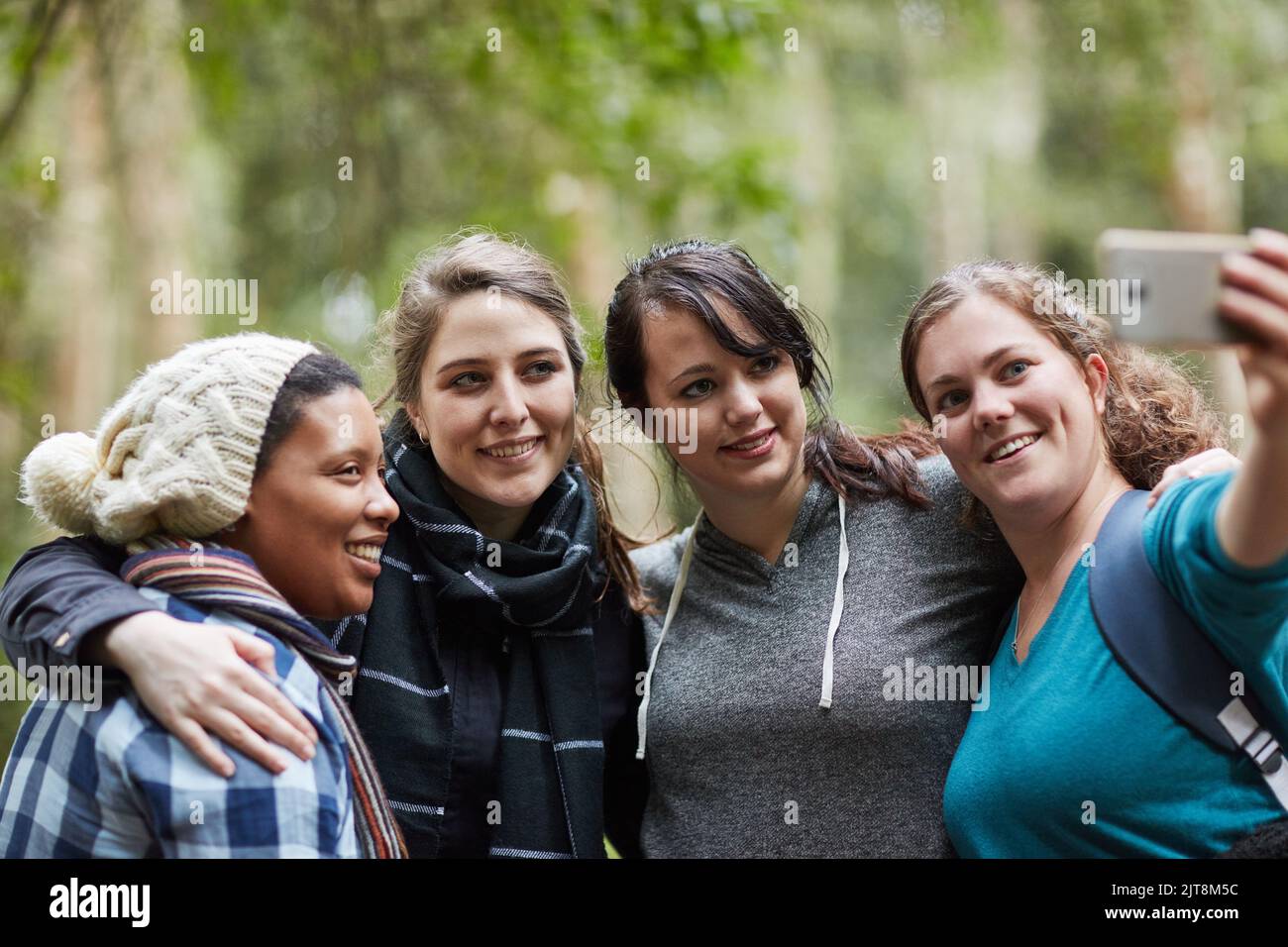 Making memories in the great outdoors. a group of friends taking a ...