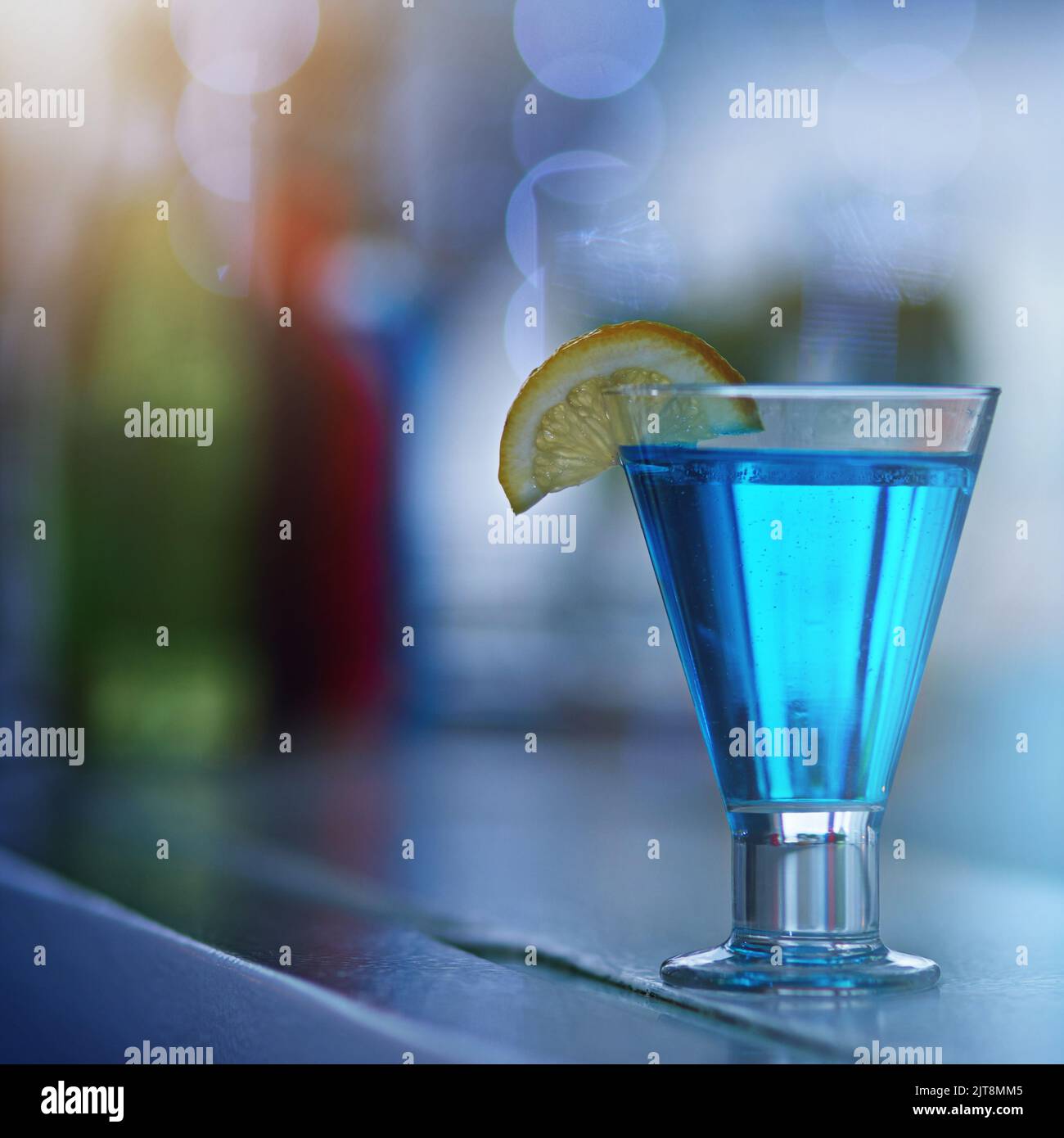 Its your party companion. a glass of alcohol on a countertop in a ...