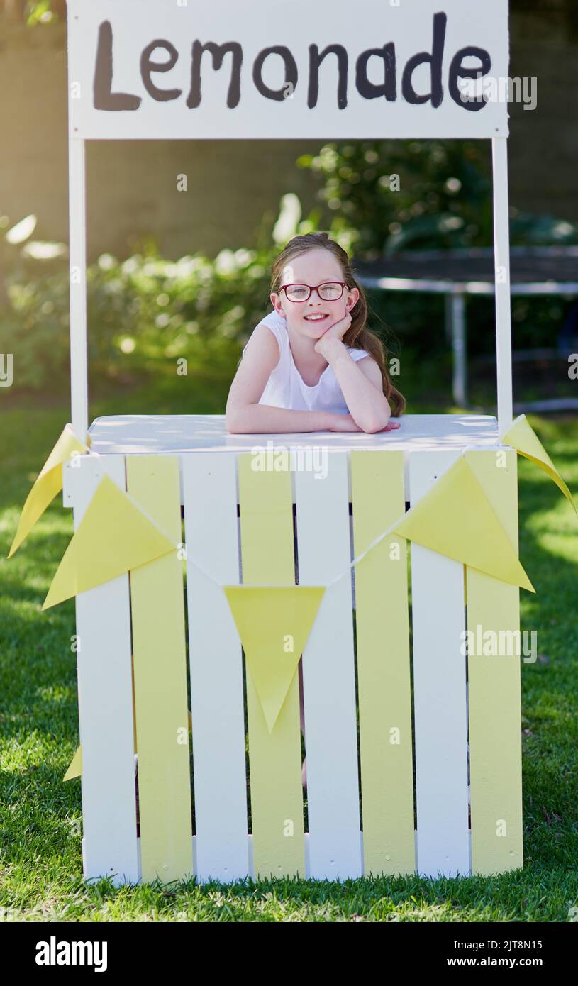 Summertime is perfect for setting up a lemonade stand. Portrait of a ...
