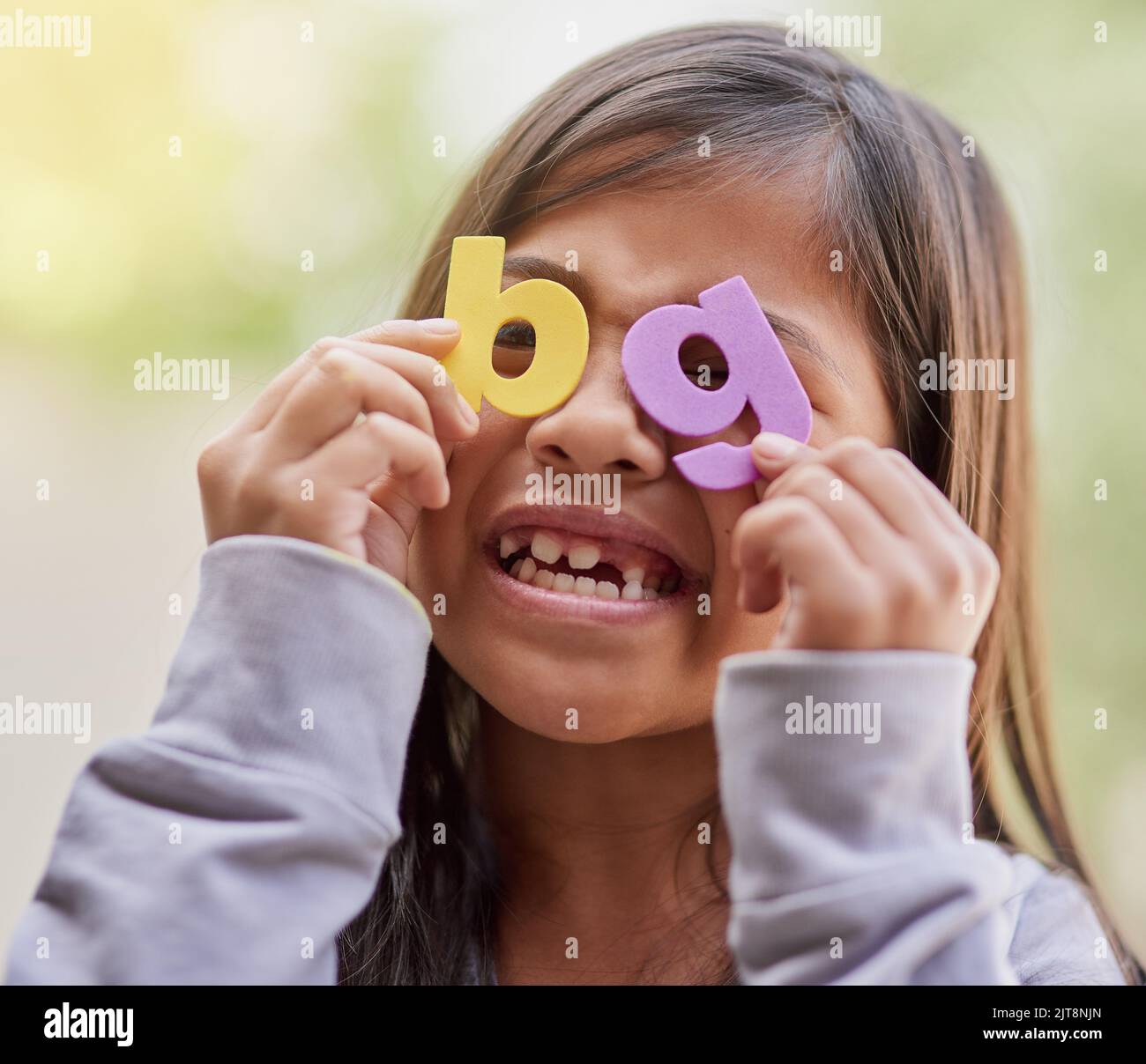 Life is all fun and games when youre a kid. a little girl covering her ...