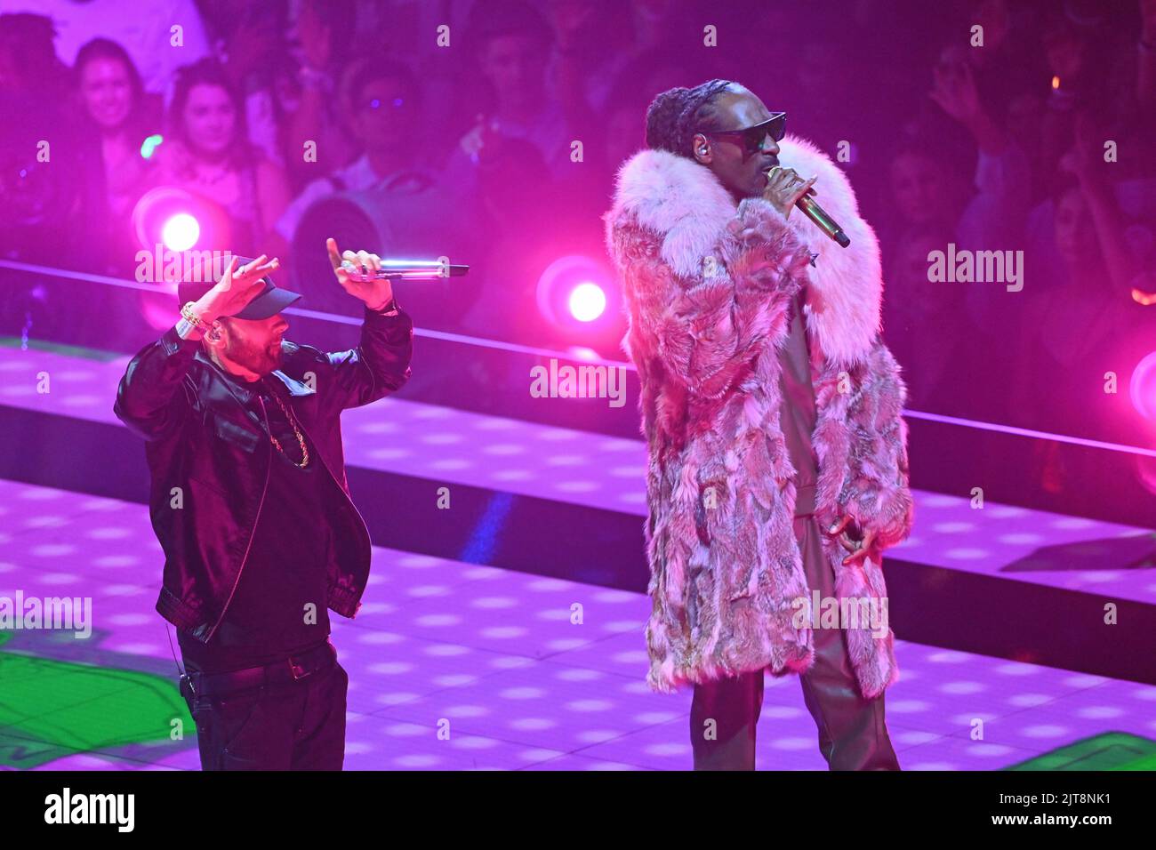Eminem (left) and Snoop Dogg perform "From the D 2 the LBC" on stage at ...