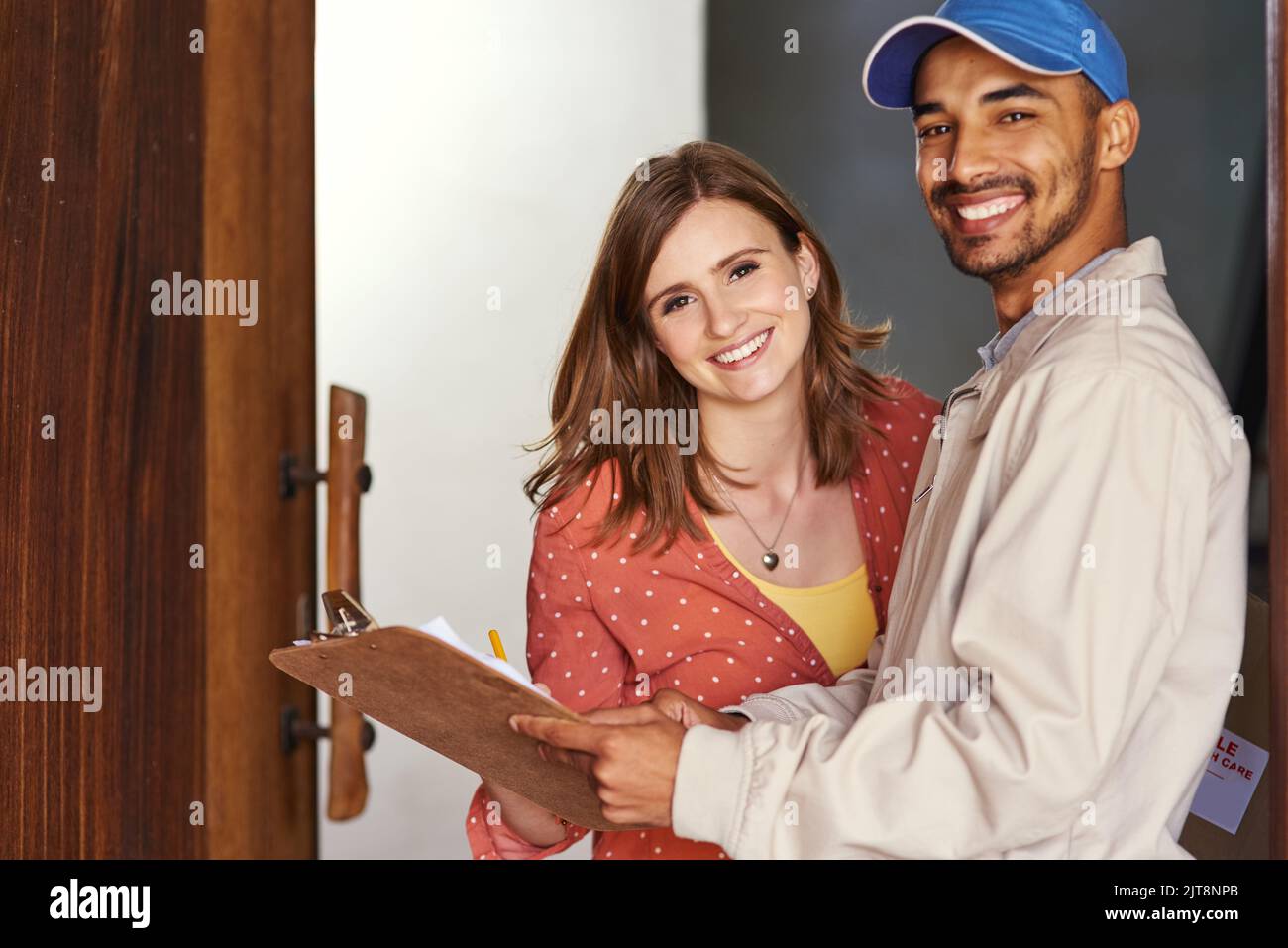 Its as simple as a signature. Cropped portrait of an attractive young ...